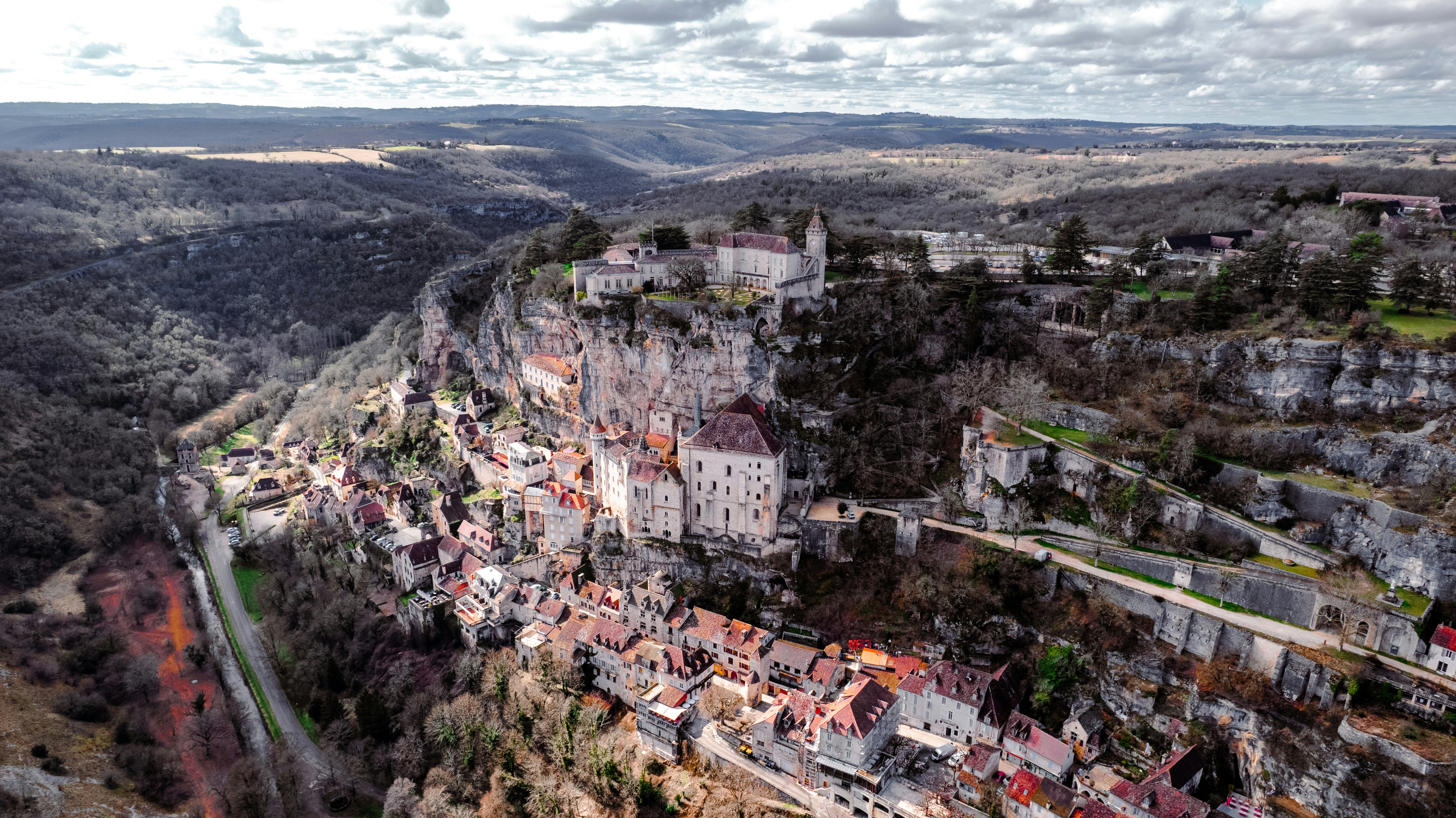 Castle Clifftop Village: Aerial View of Historic Fortifications Above a Terraced Town