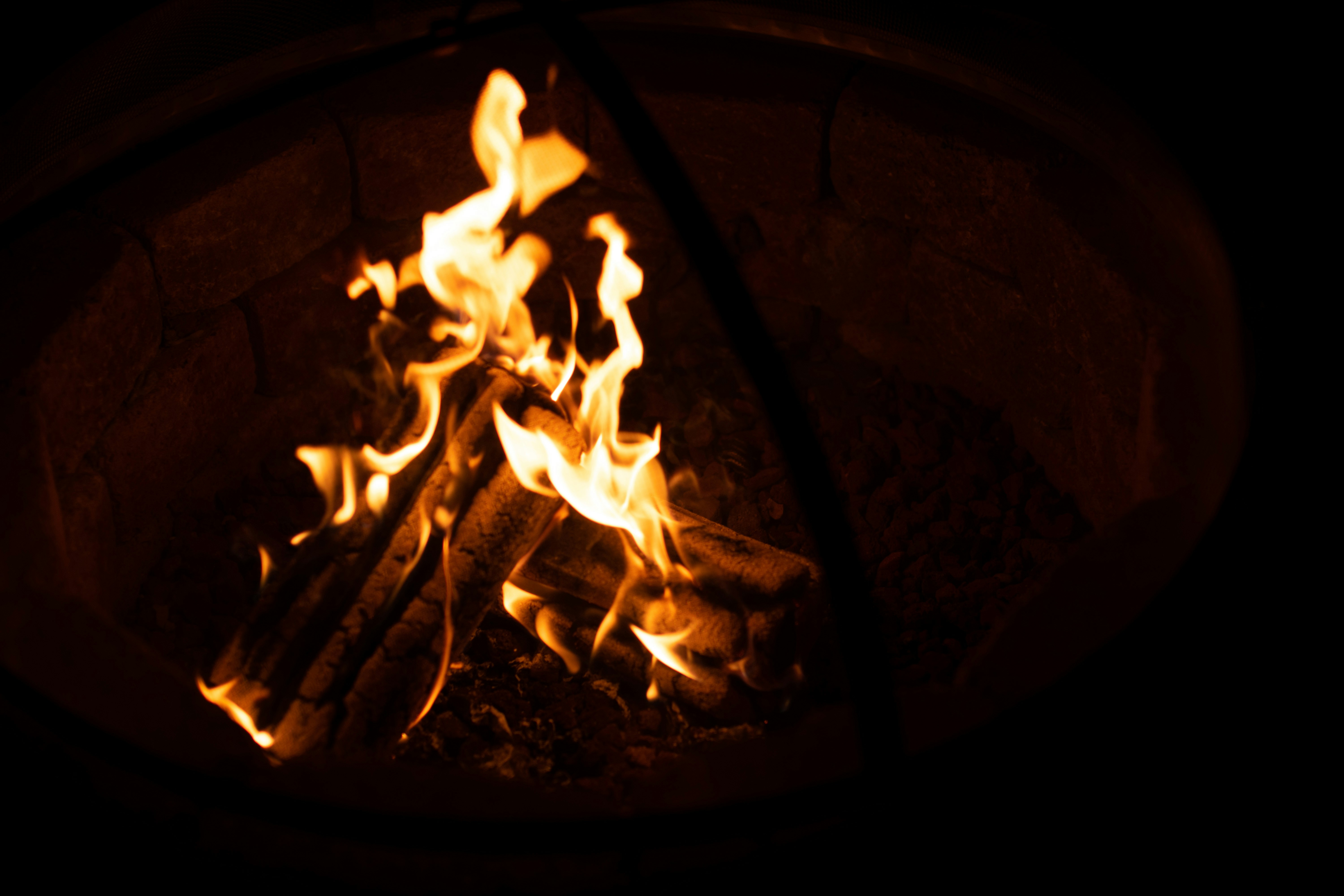 A close up of a fire in a fire pit photo – Free Summer night Image on ...