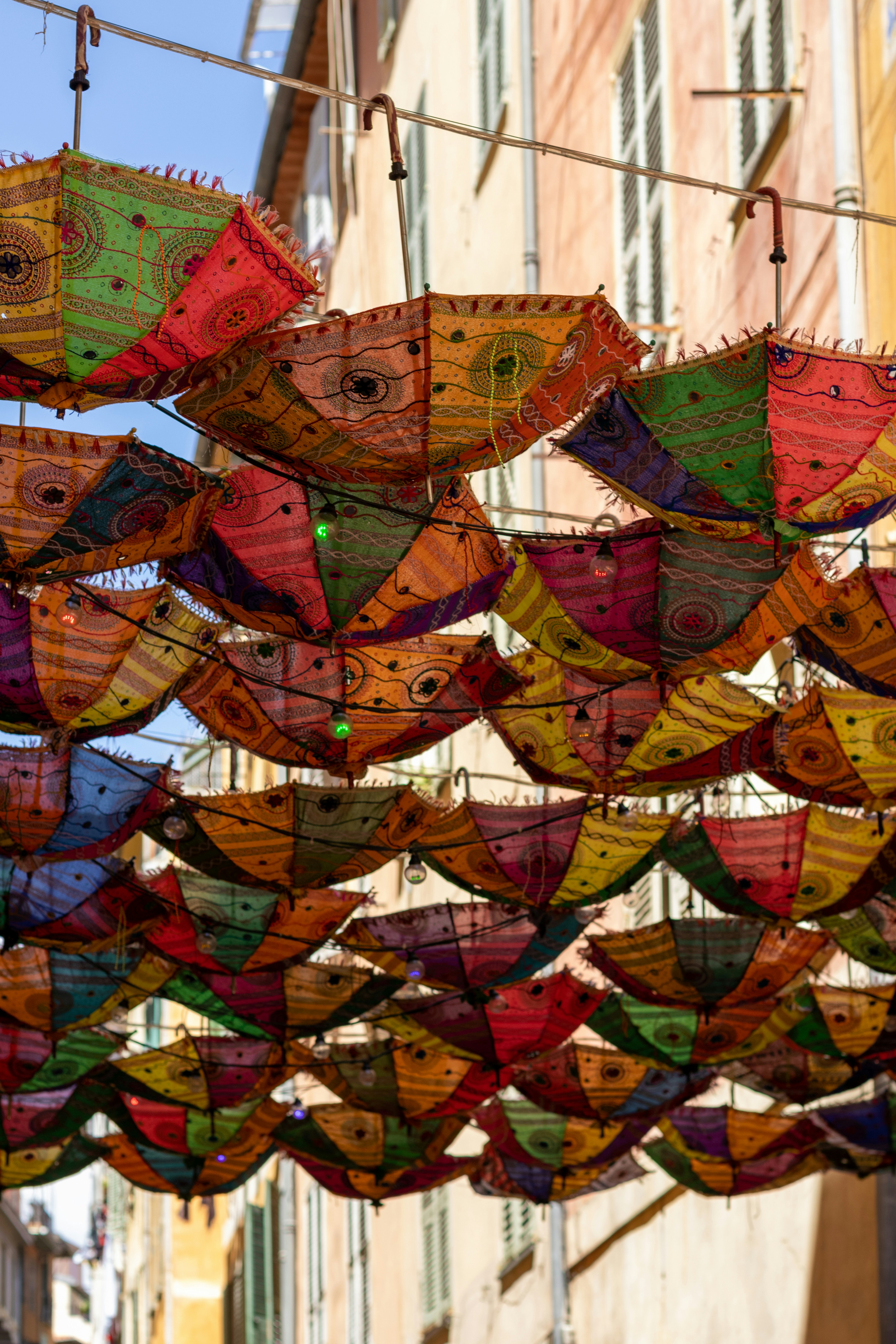 A bunch of umbrellas hanging in the air photo – Free Nice Image on Unsplash