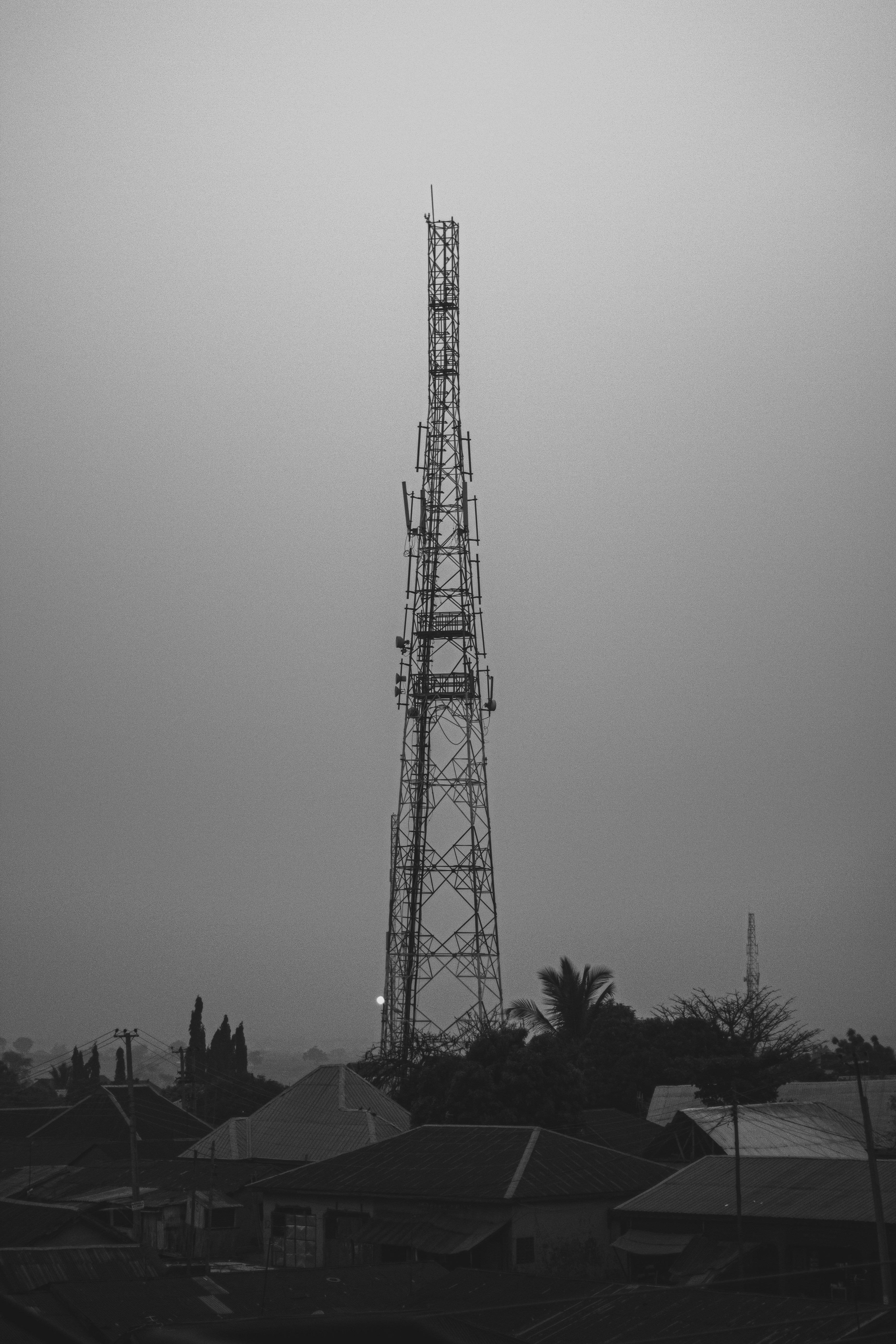 Vertical Sentinel: A Steel Lattice Tower Looms Over a Quiet Township