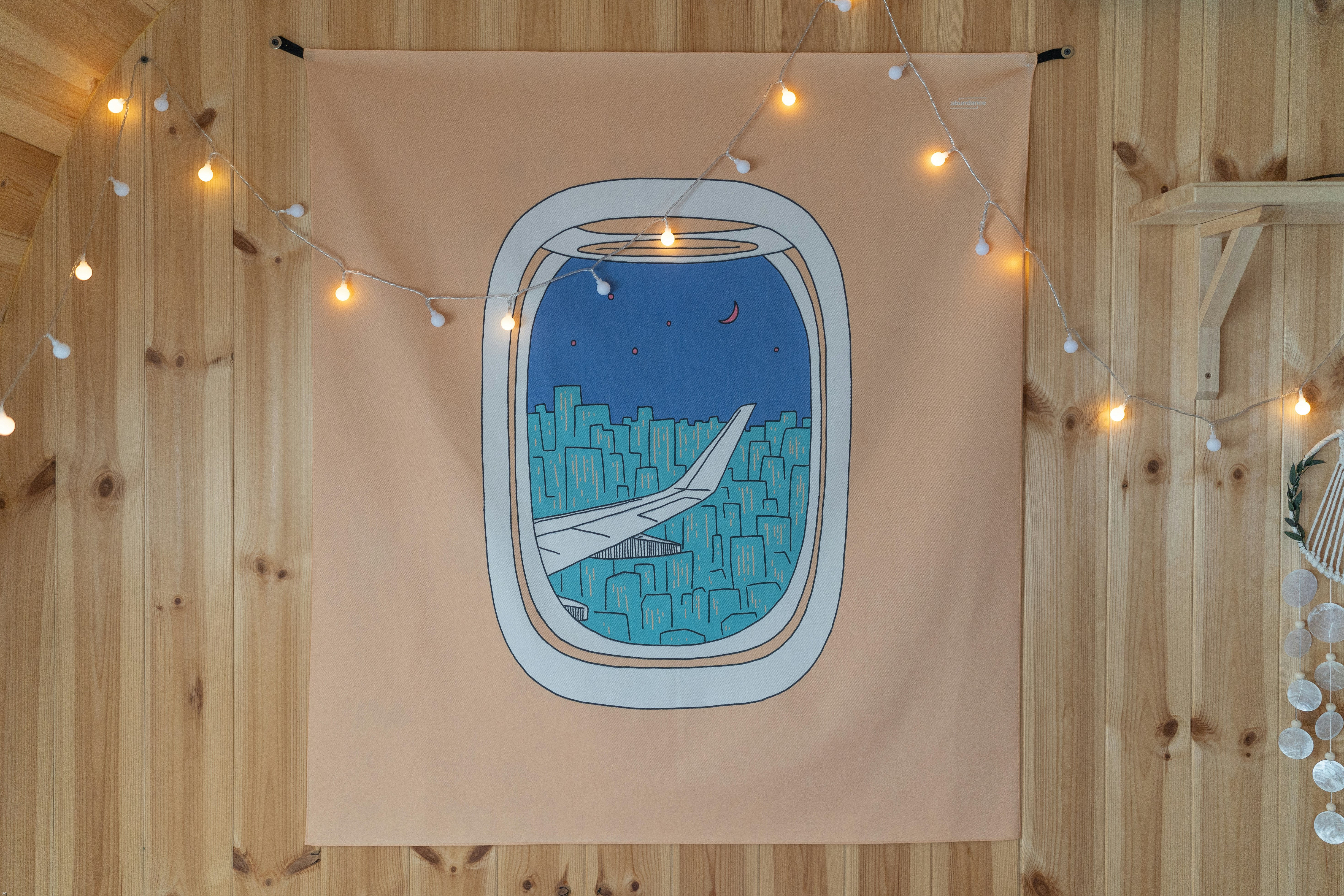 Winged window: a pastel banner in warm wooden glow