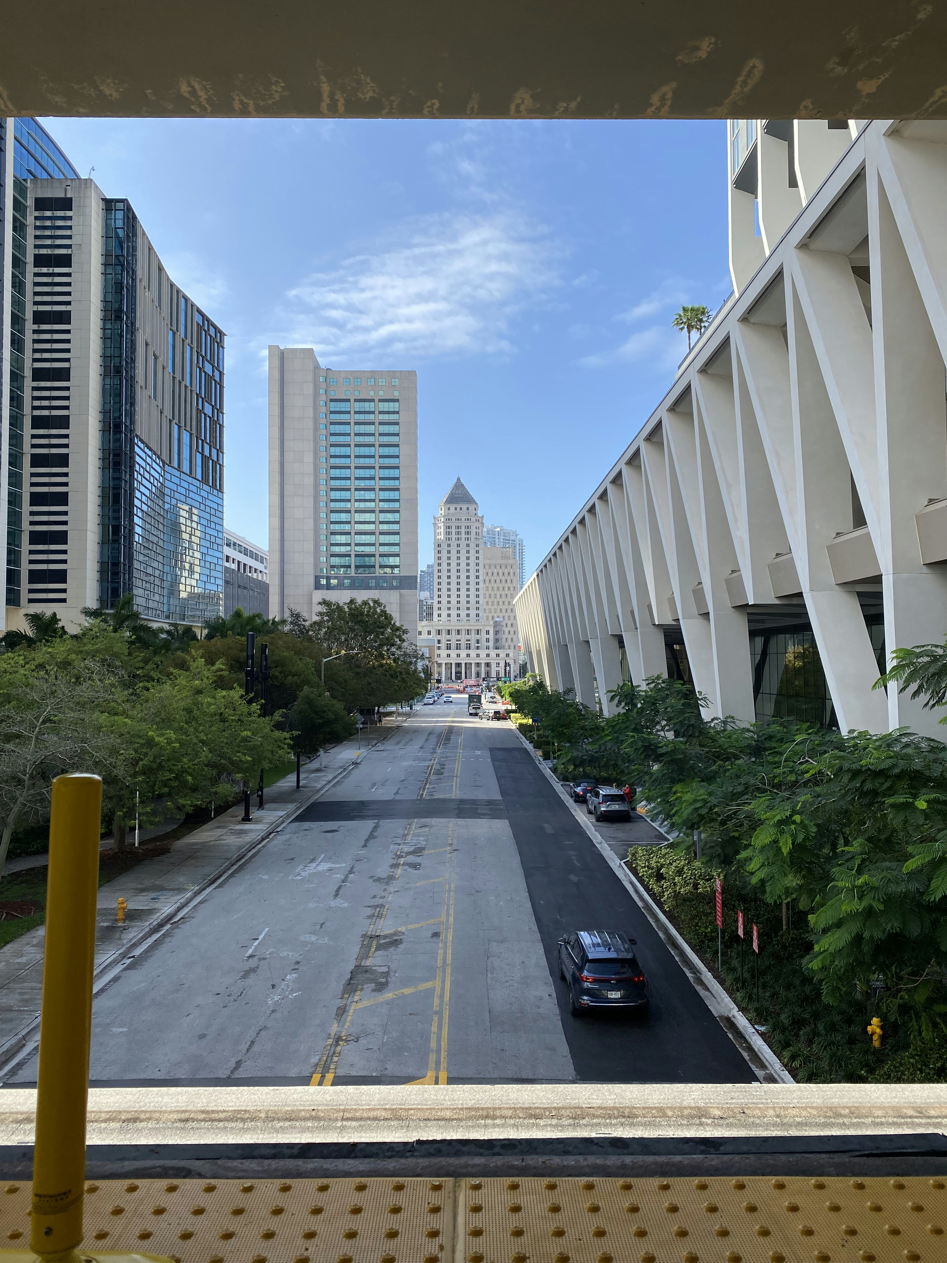 A view of a city street from inside a building photo – Free Road Image ...