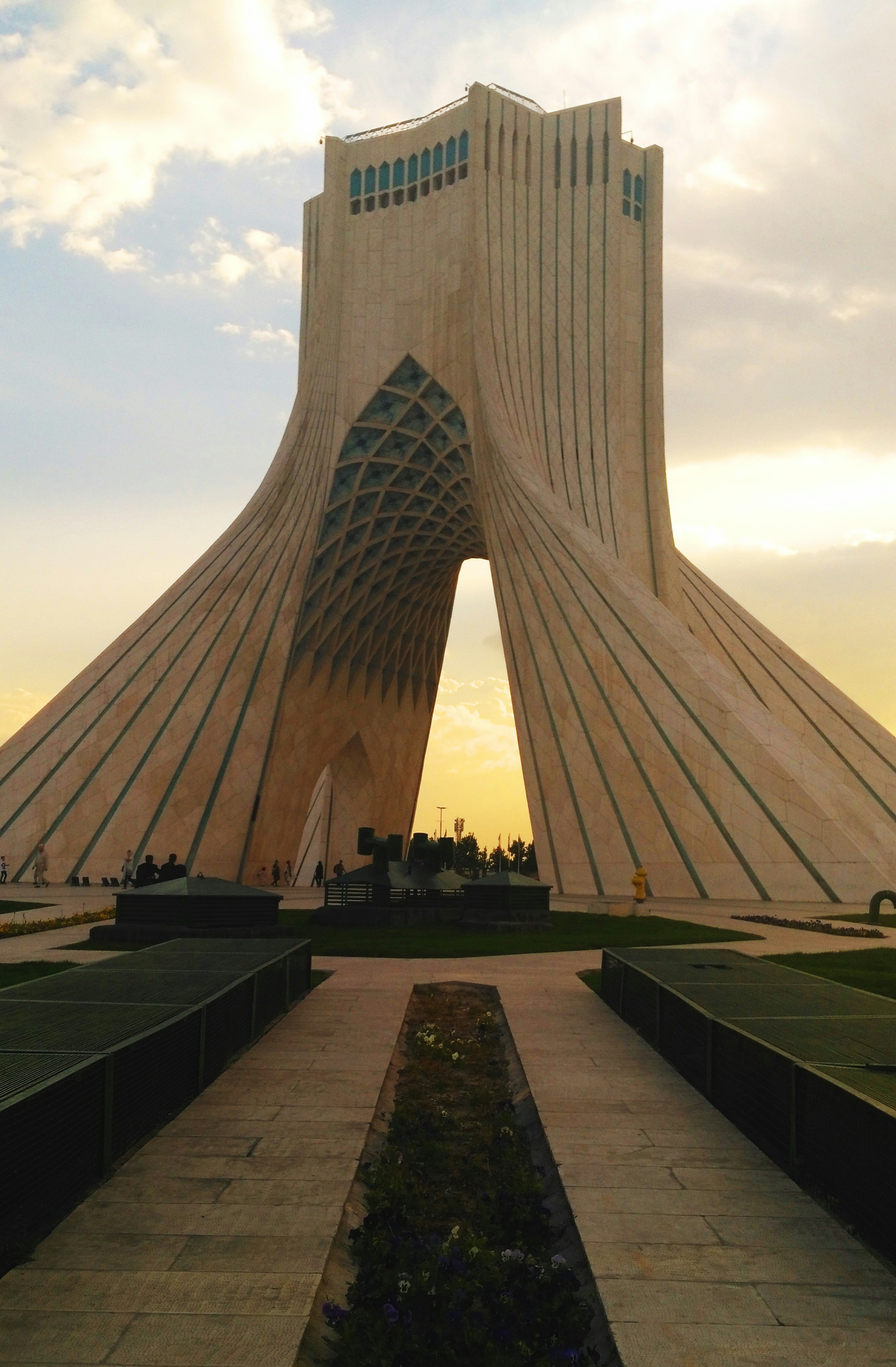 Tehran's Azadi Tower at Golden Hour: Converging Lines and Silent Gardens