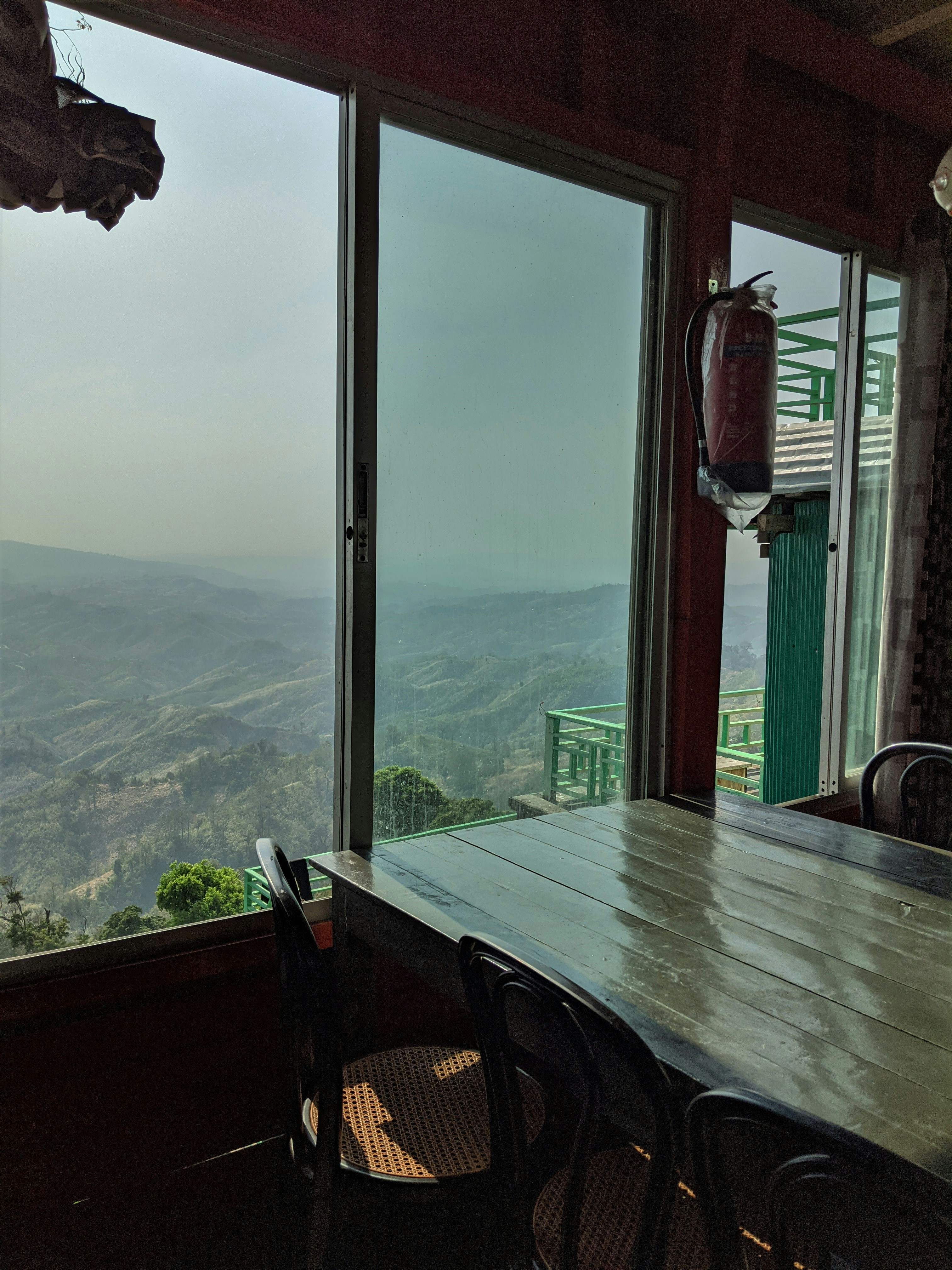 Valley Horizon Framed by a Rustic Café Window