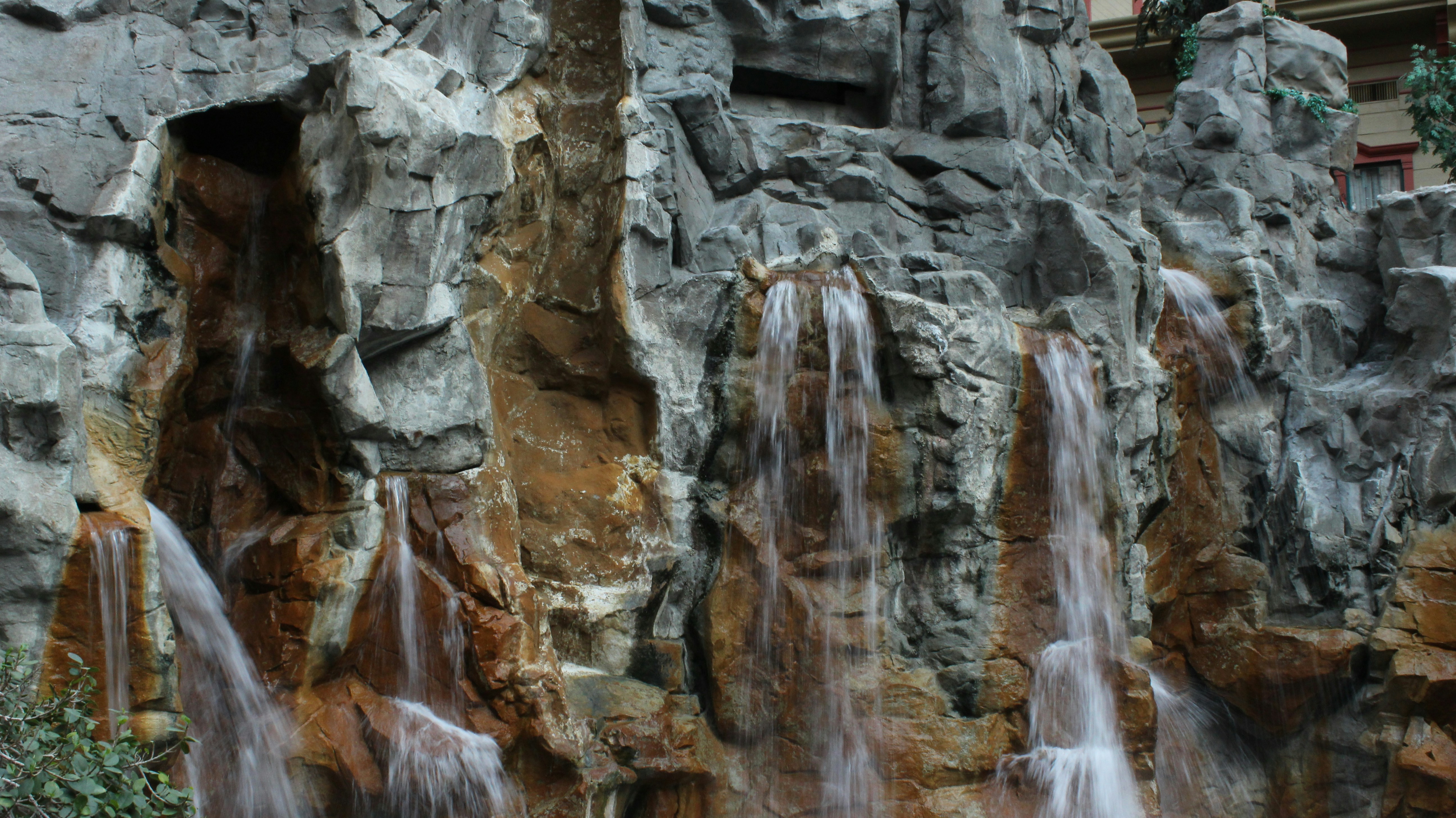 A group of waterfalls that are next to a building photo – Free Grey ...