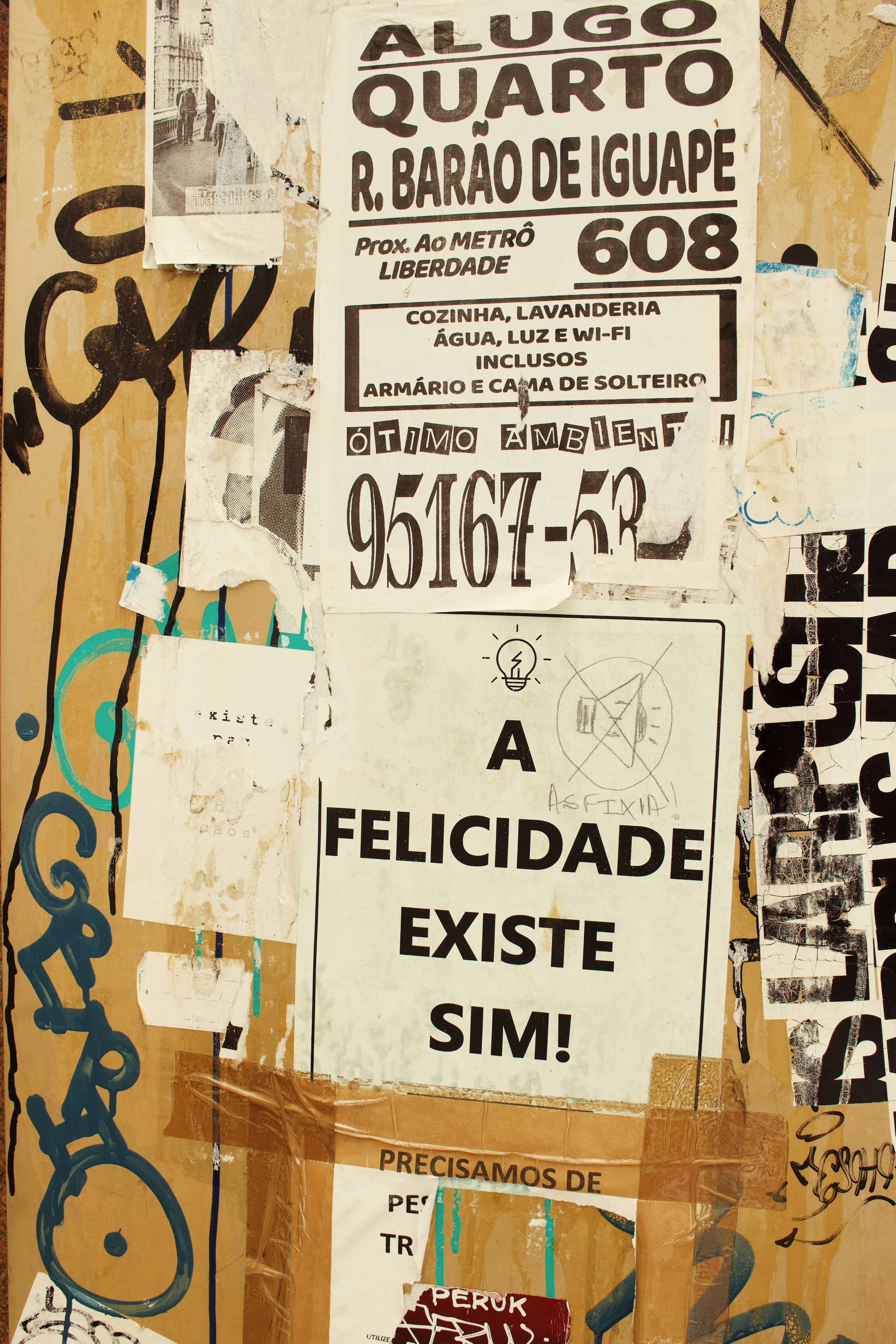 A bunch of graffiti on the side of a building photo – Free Beige Image ...