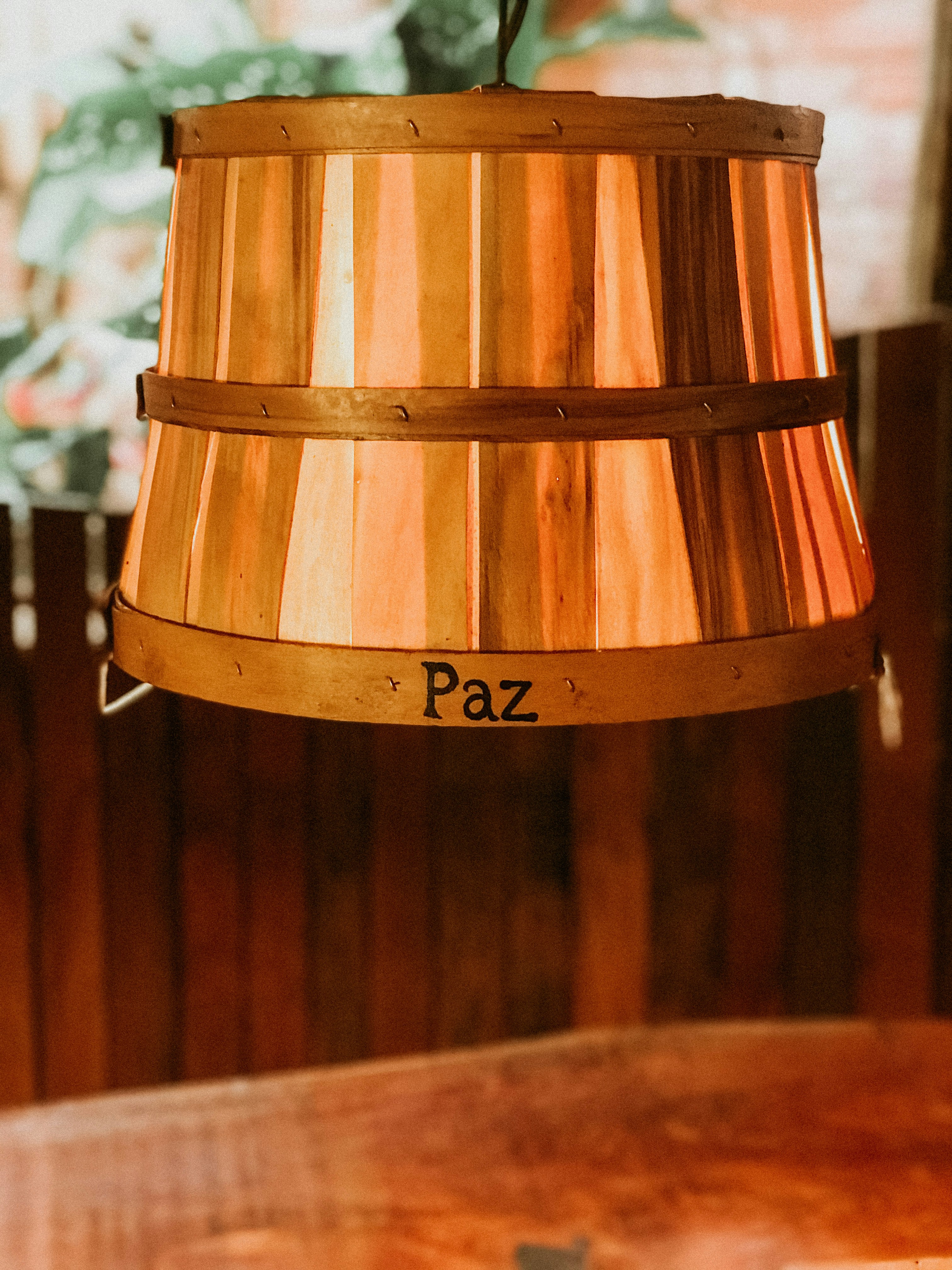 Paz Lamp Shade: Amber Glow in a Rustic Dining Nook