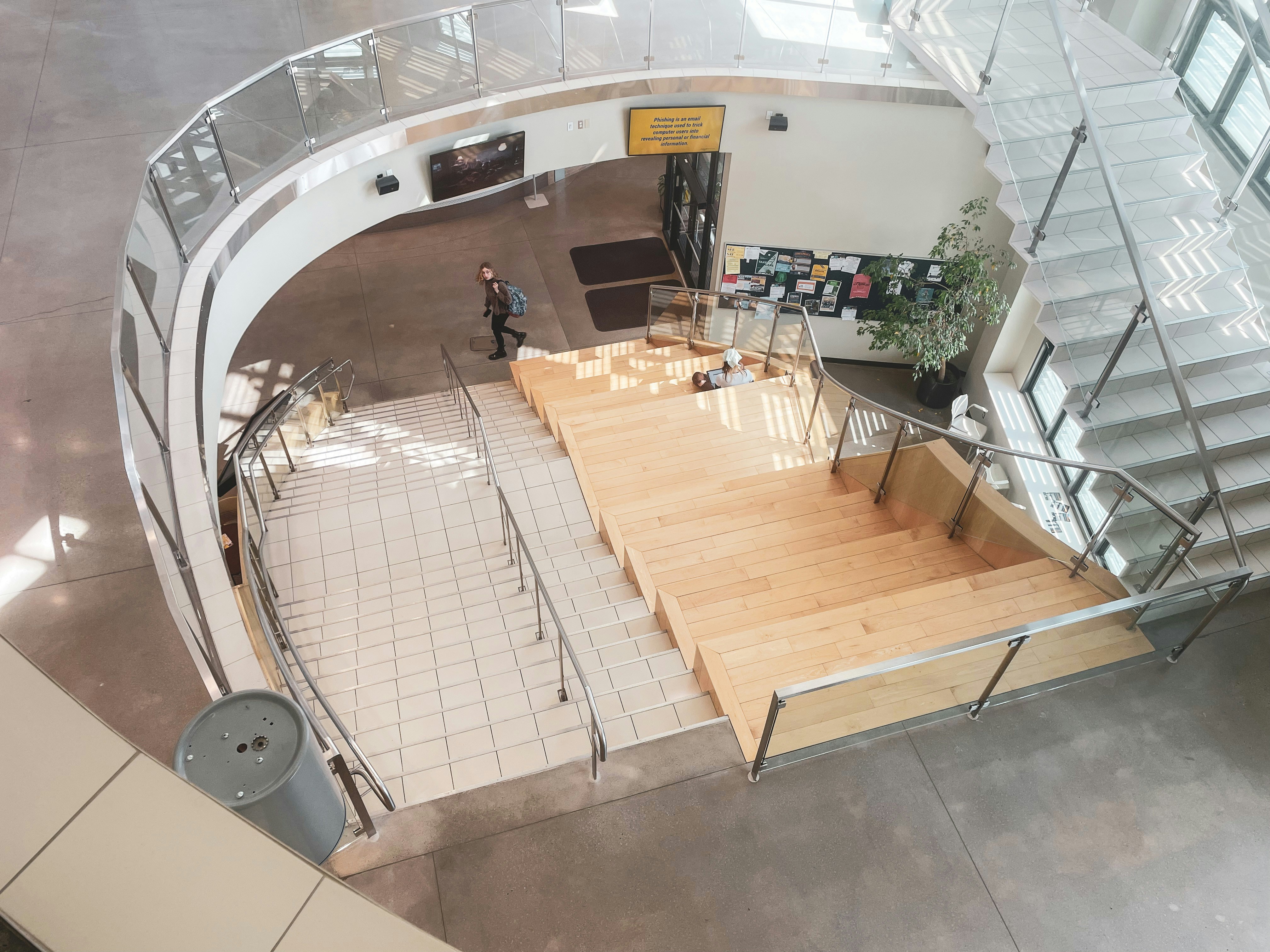 A view of a staircase from the second floor of a building photo – Free ...
