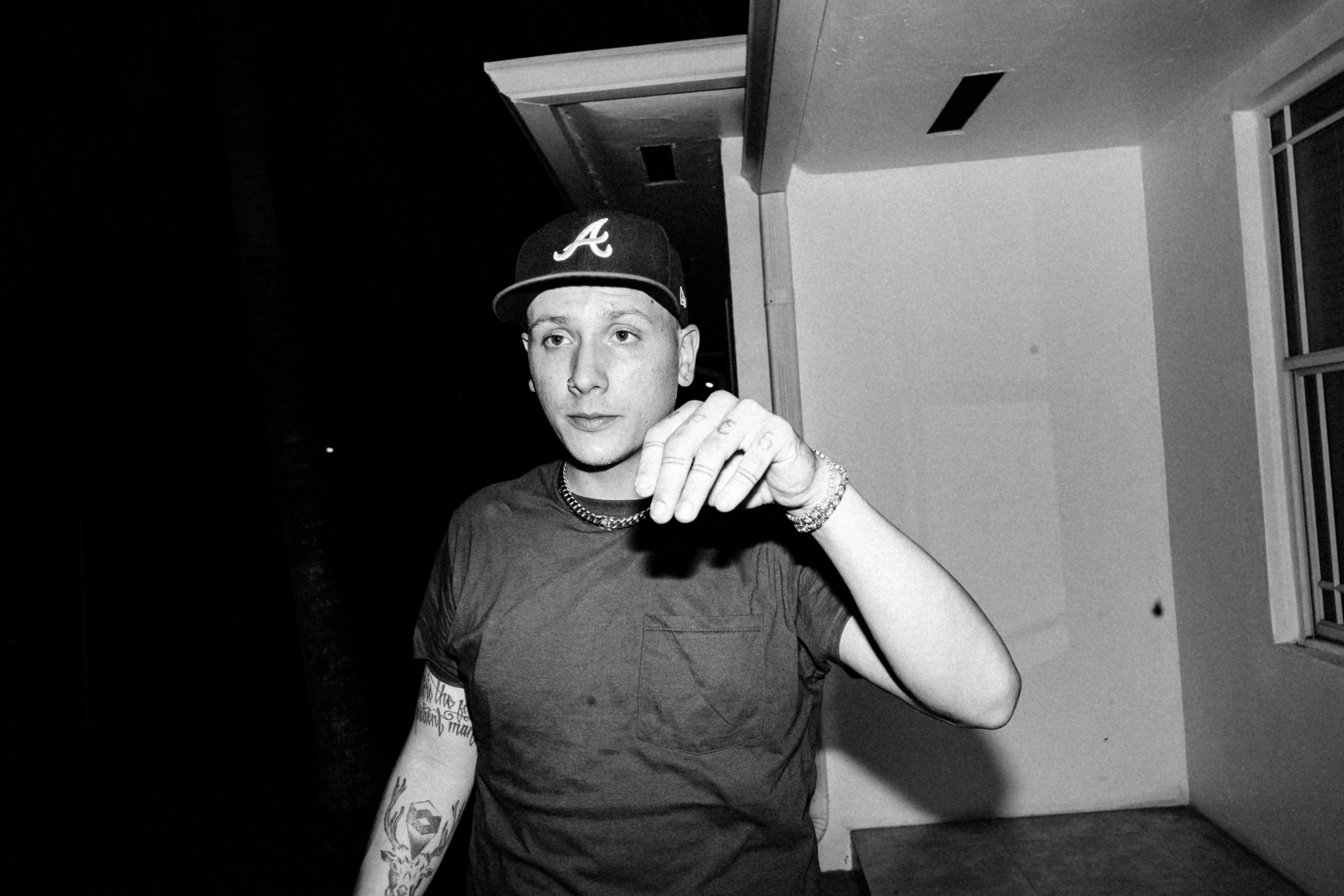 A man in a baseball cap brushing his teeth photo – Free Grey Image on ...