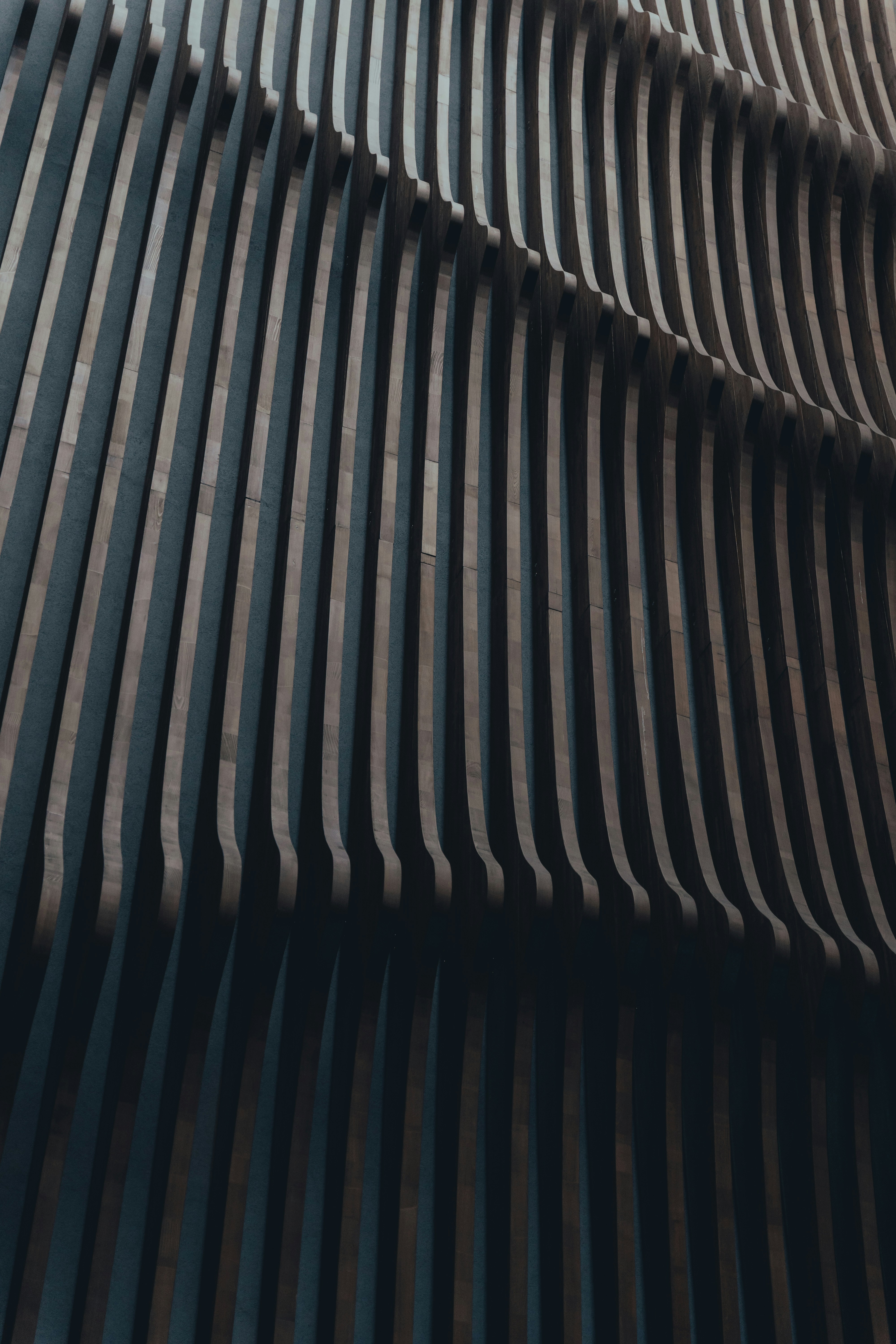 A close up of a building with wavy lines on it photo – Free Grey Image ...