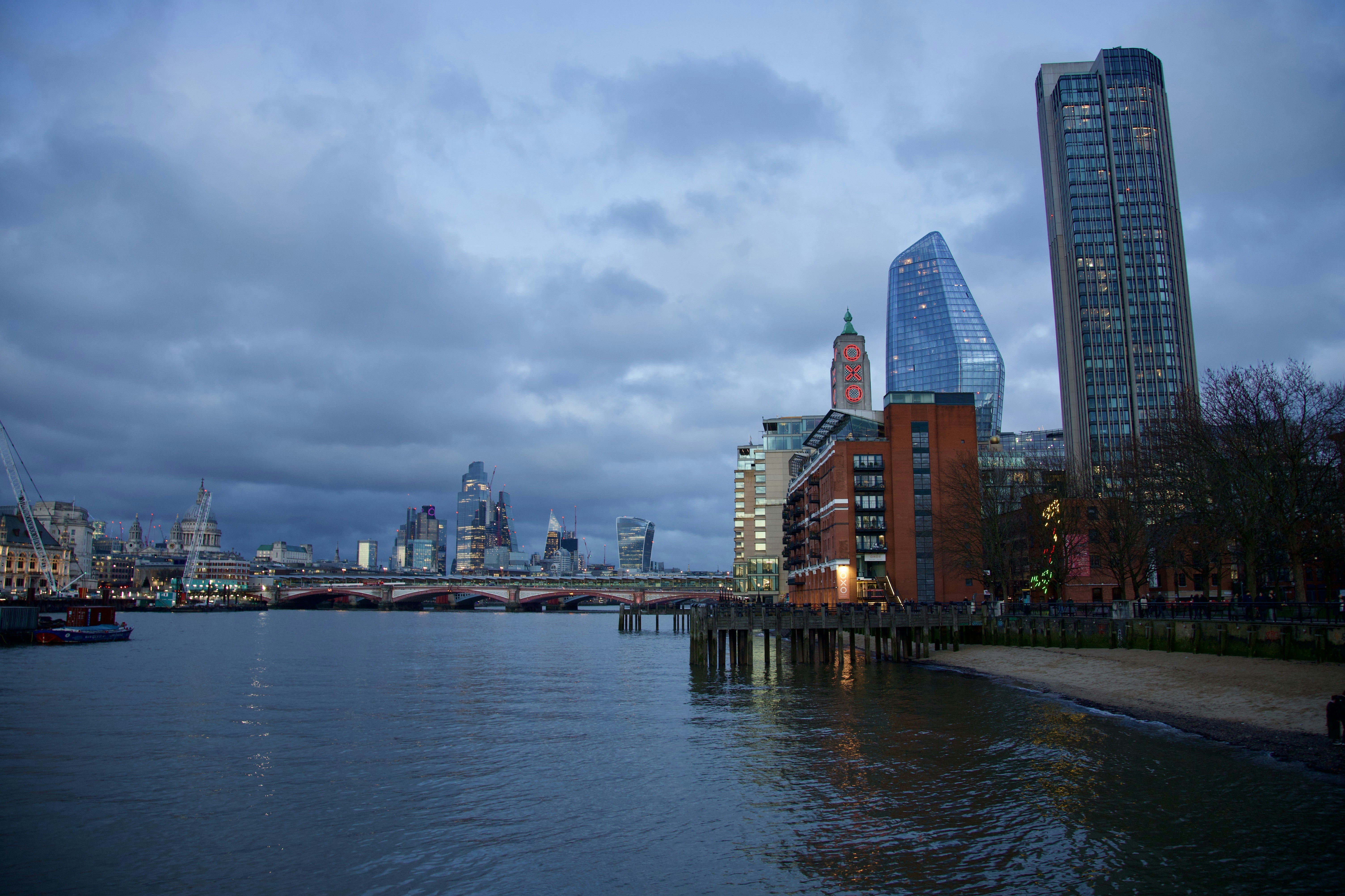 a body of water with a city in the background