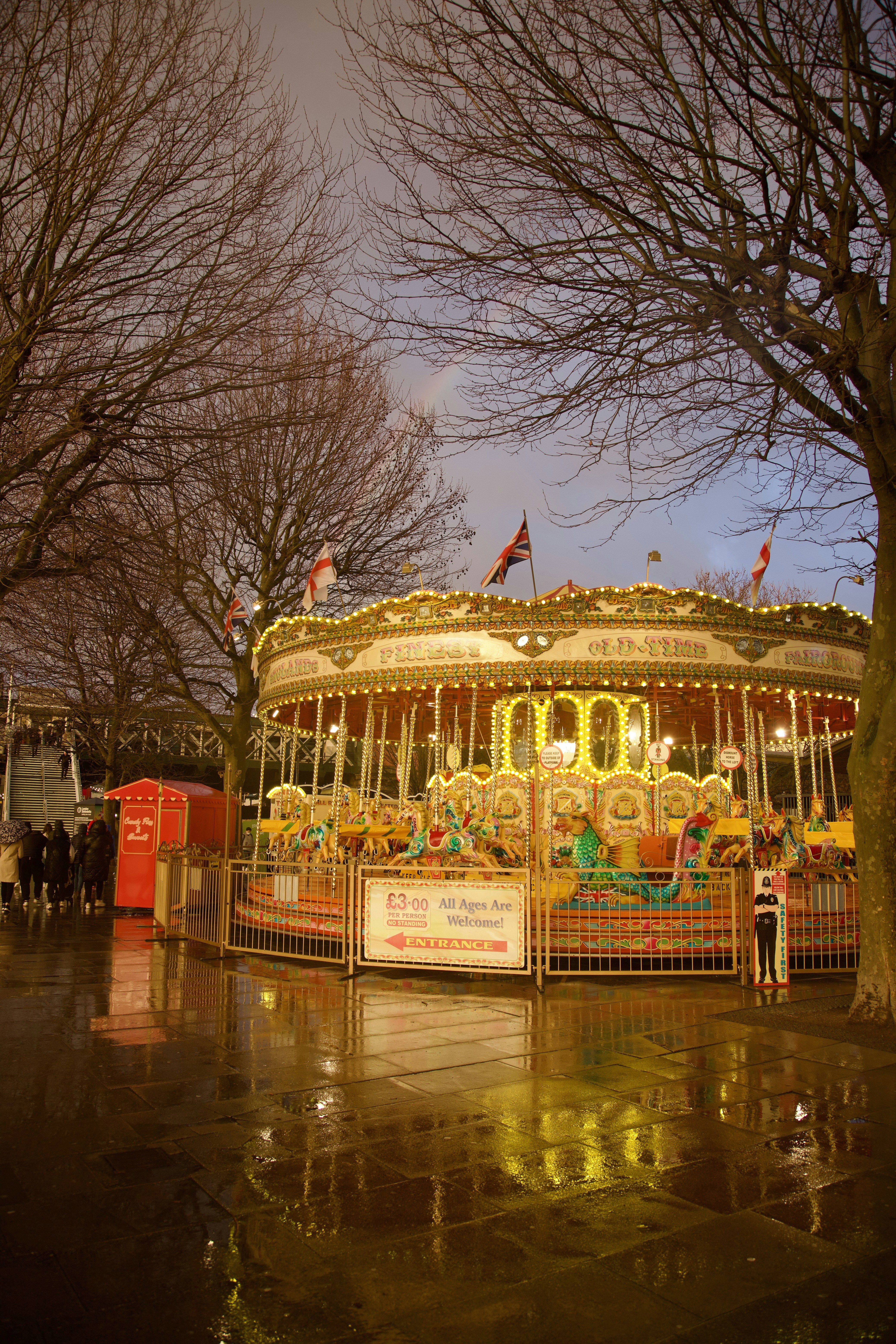 Amber Carousel in a Rain-Wet Night: Warm Lights on a Quiet Square