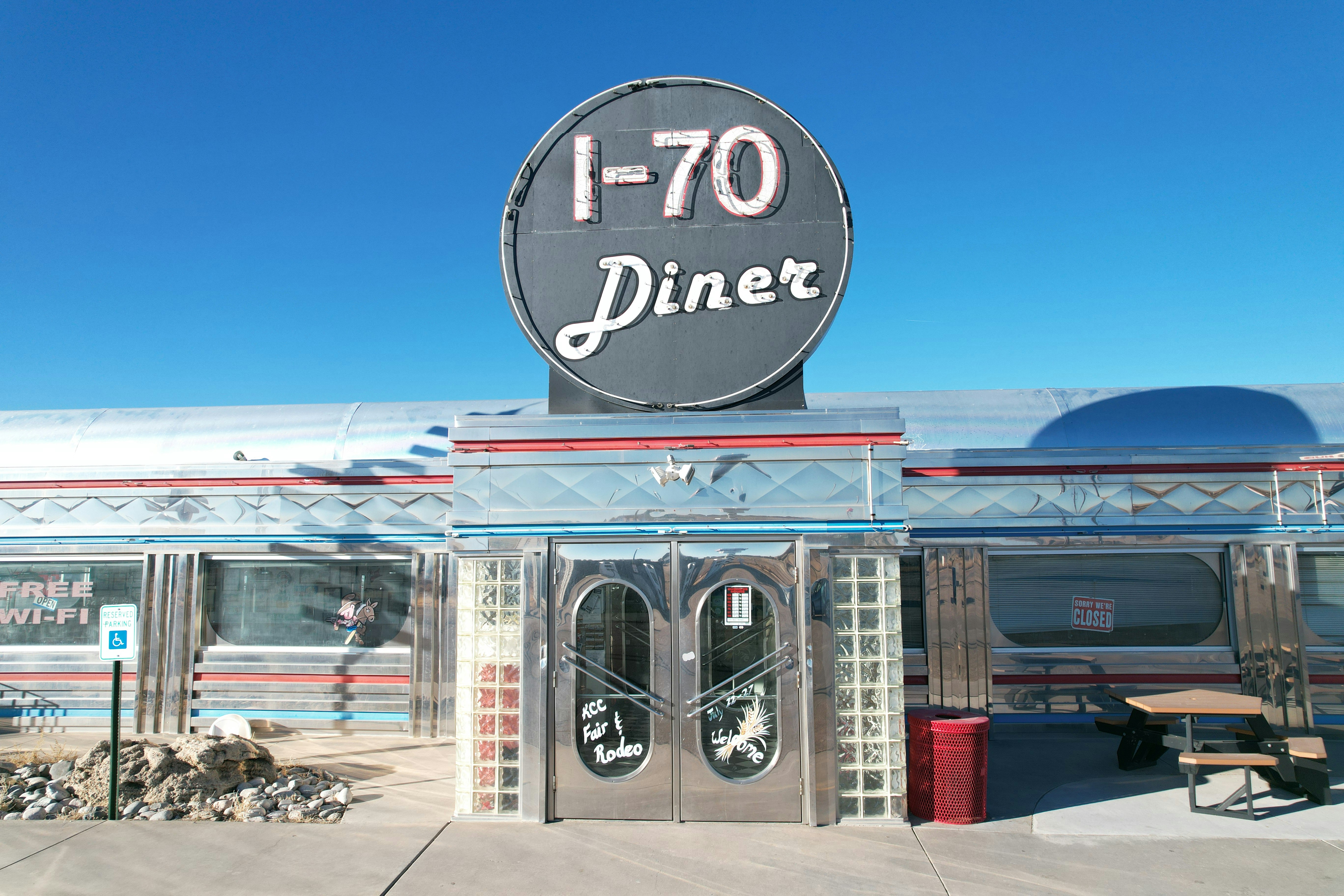 Retro Diner Signover: A Chrome-Faced Icon Above a Neon Front