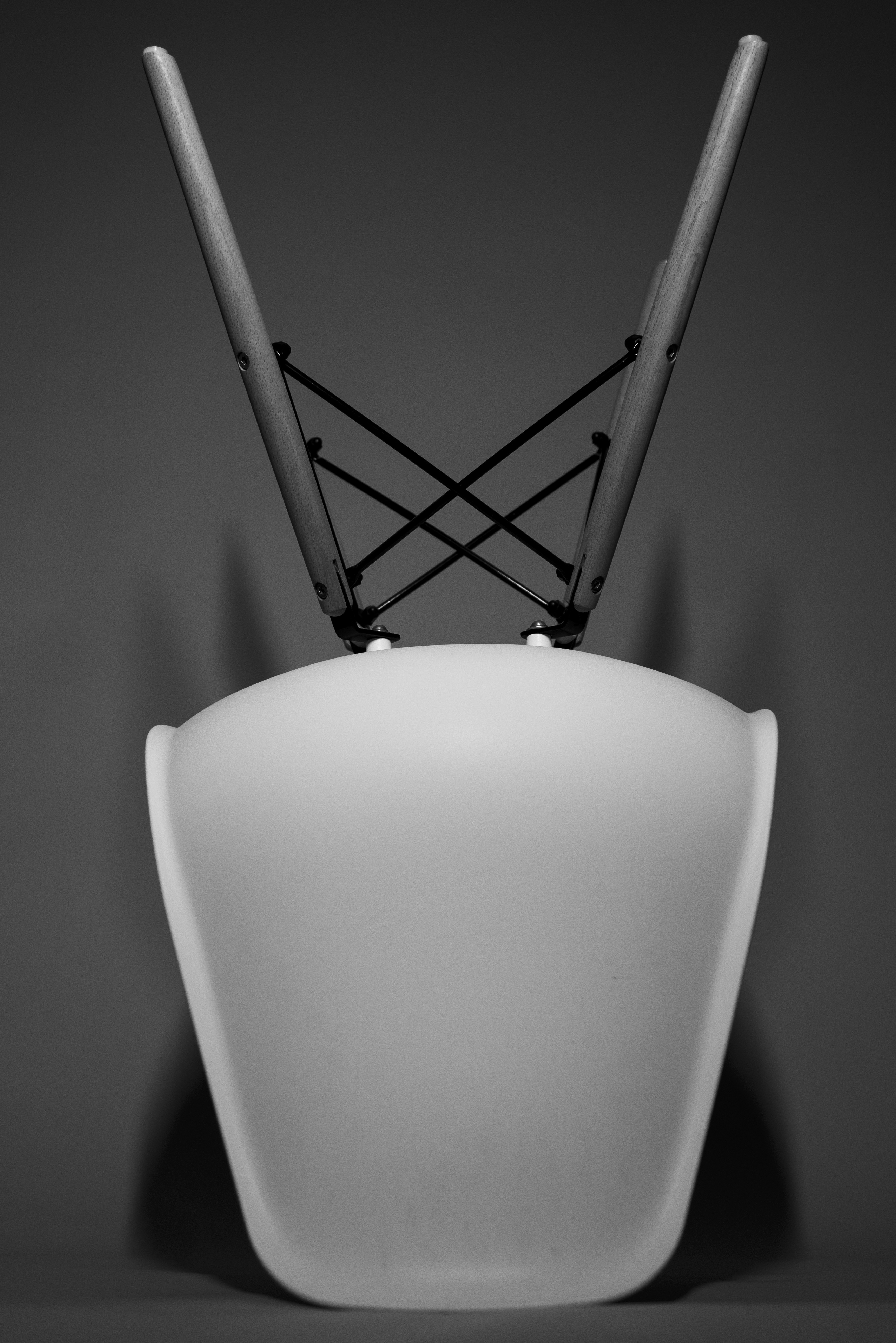 Symmetry in Steel: The X-Brace Chair in a Monochrome Studio