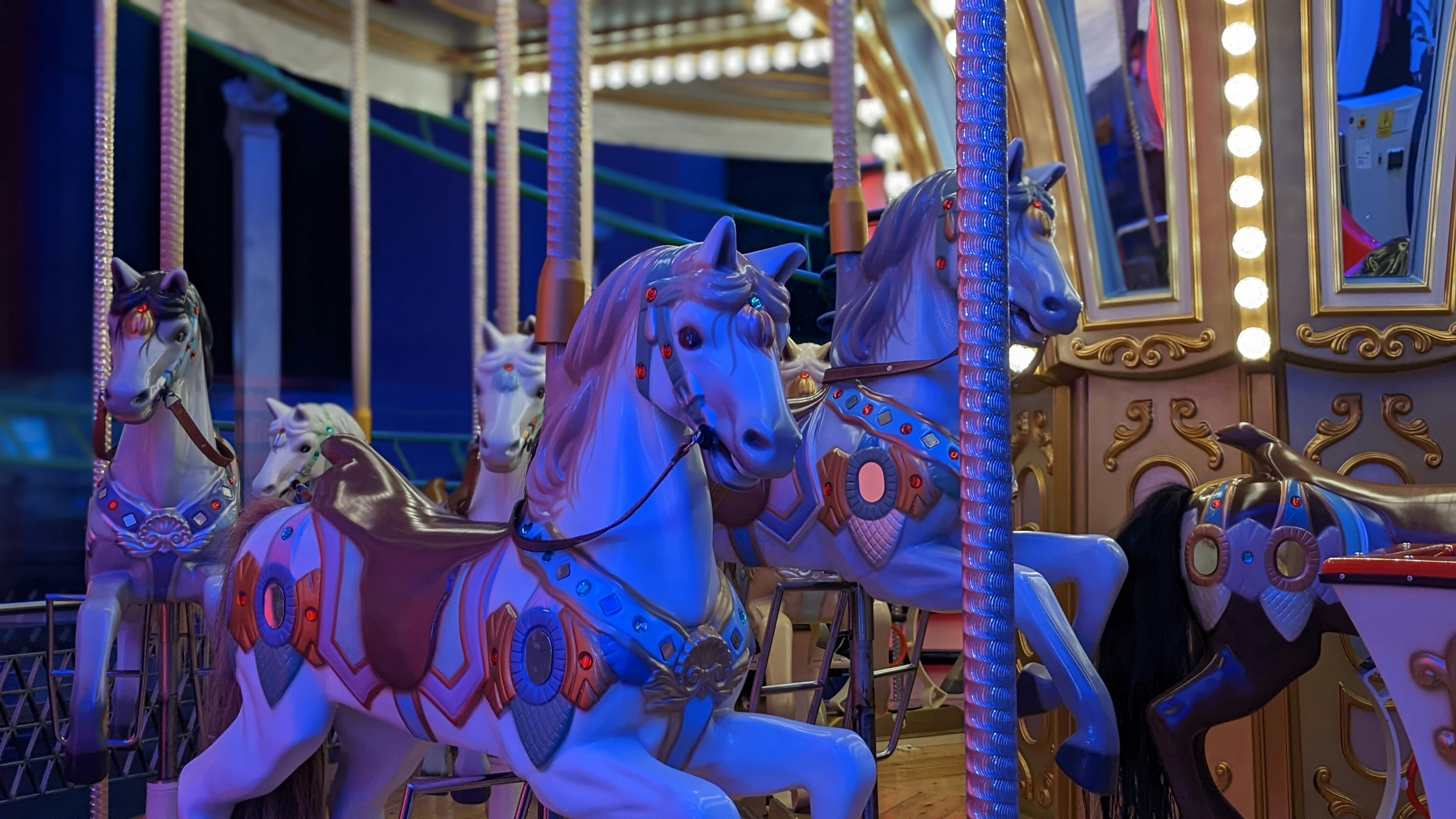 A merry go round with horses on a merry go round ride photo – Free ...