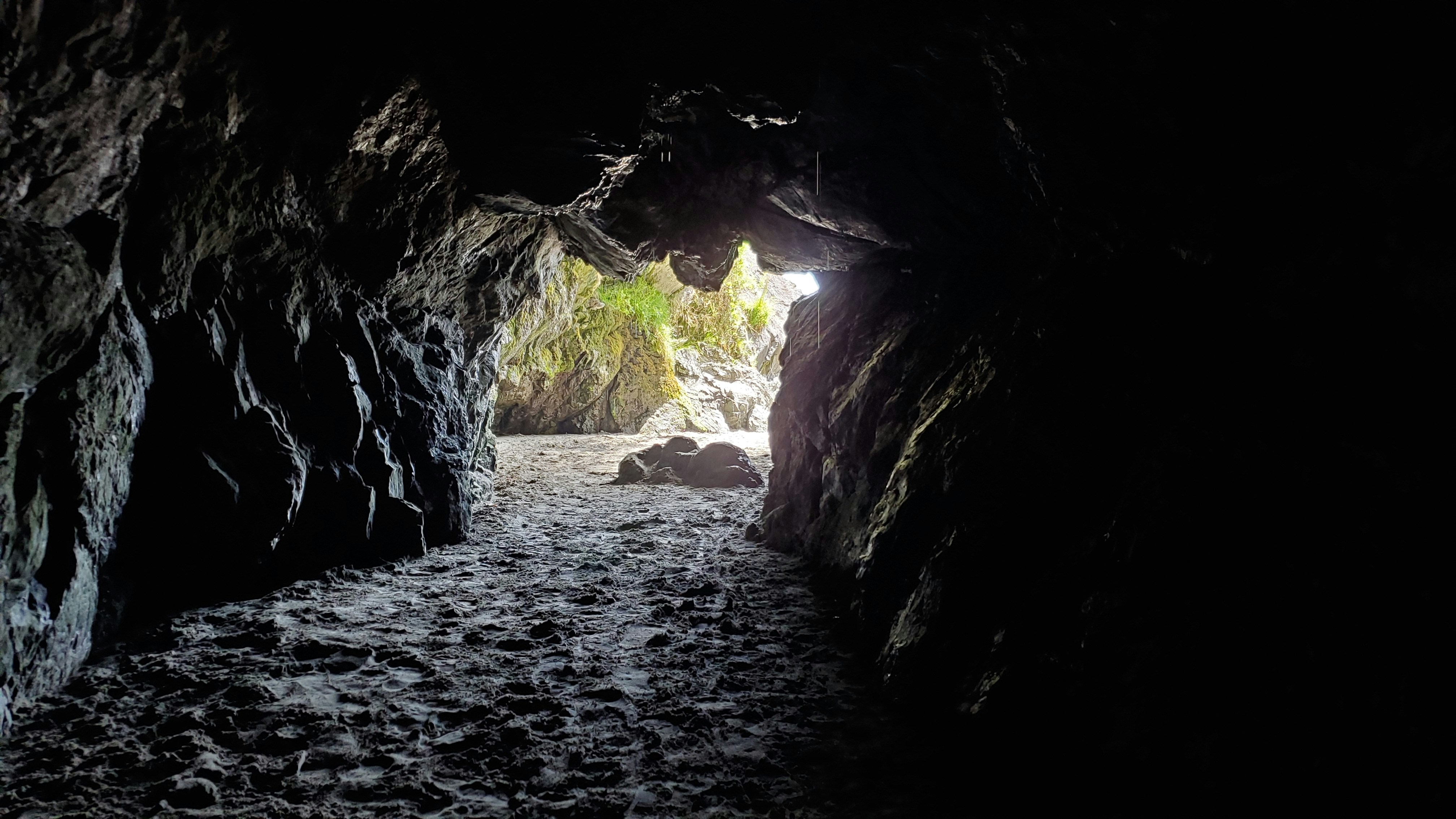 a cave with a light at the end of itTim Oldenkamp