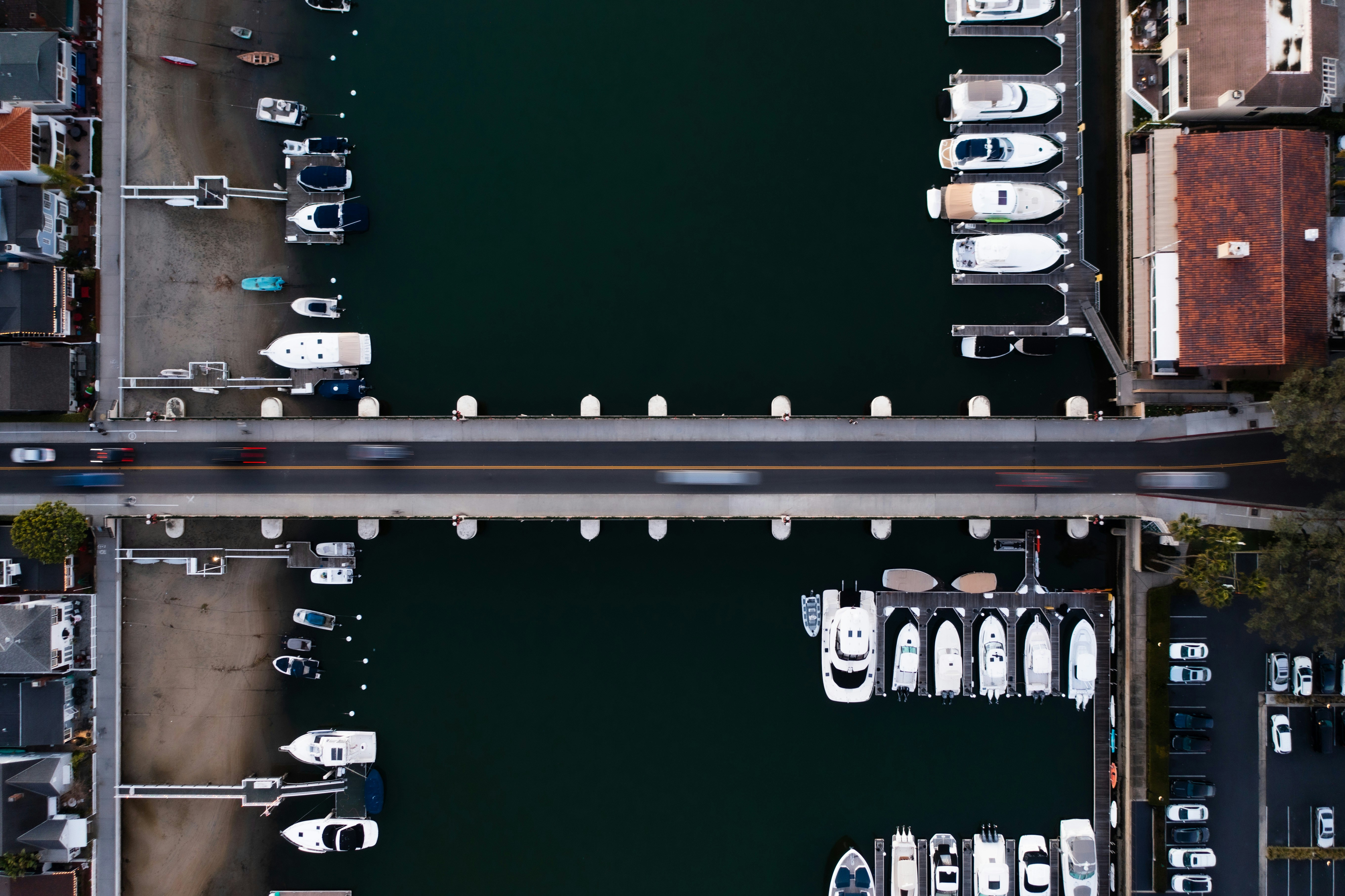 an aerial view of boats docked at a pier