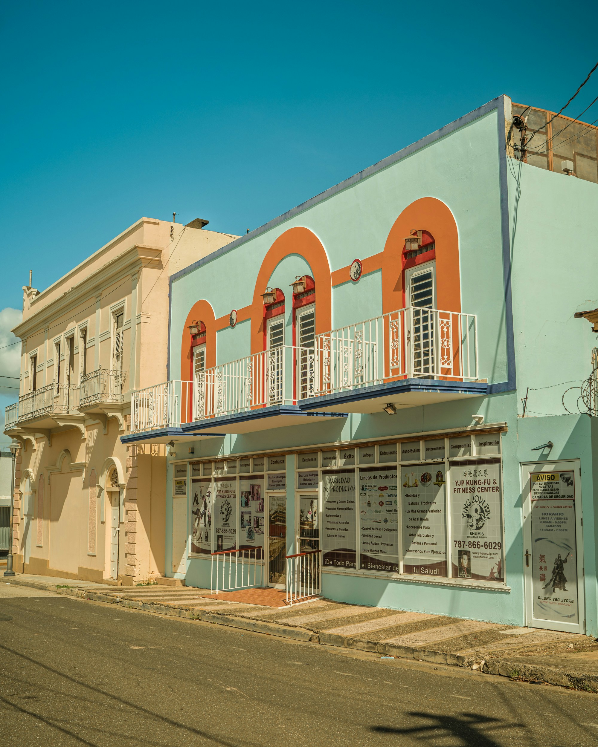 A blue and orange building on a street corner photo – Free Puerto rico ...