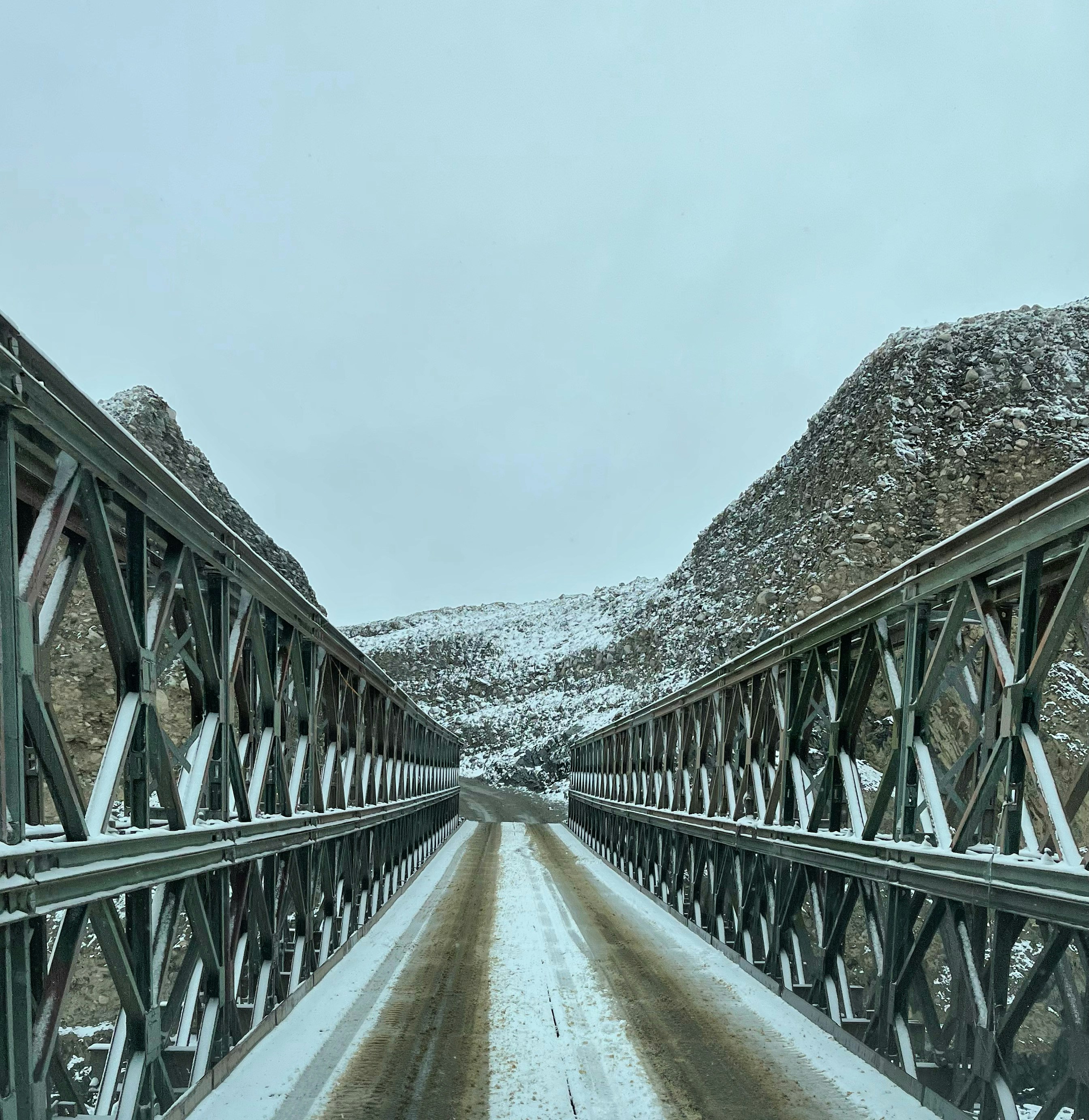 A bridge that has snow on the ground photo – Free Blue Image on Unsplash
