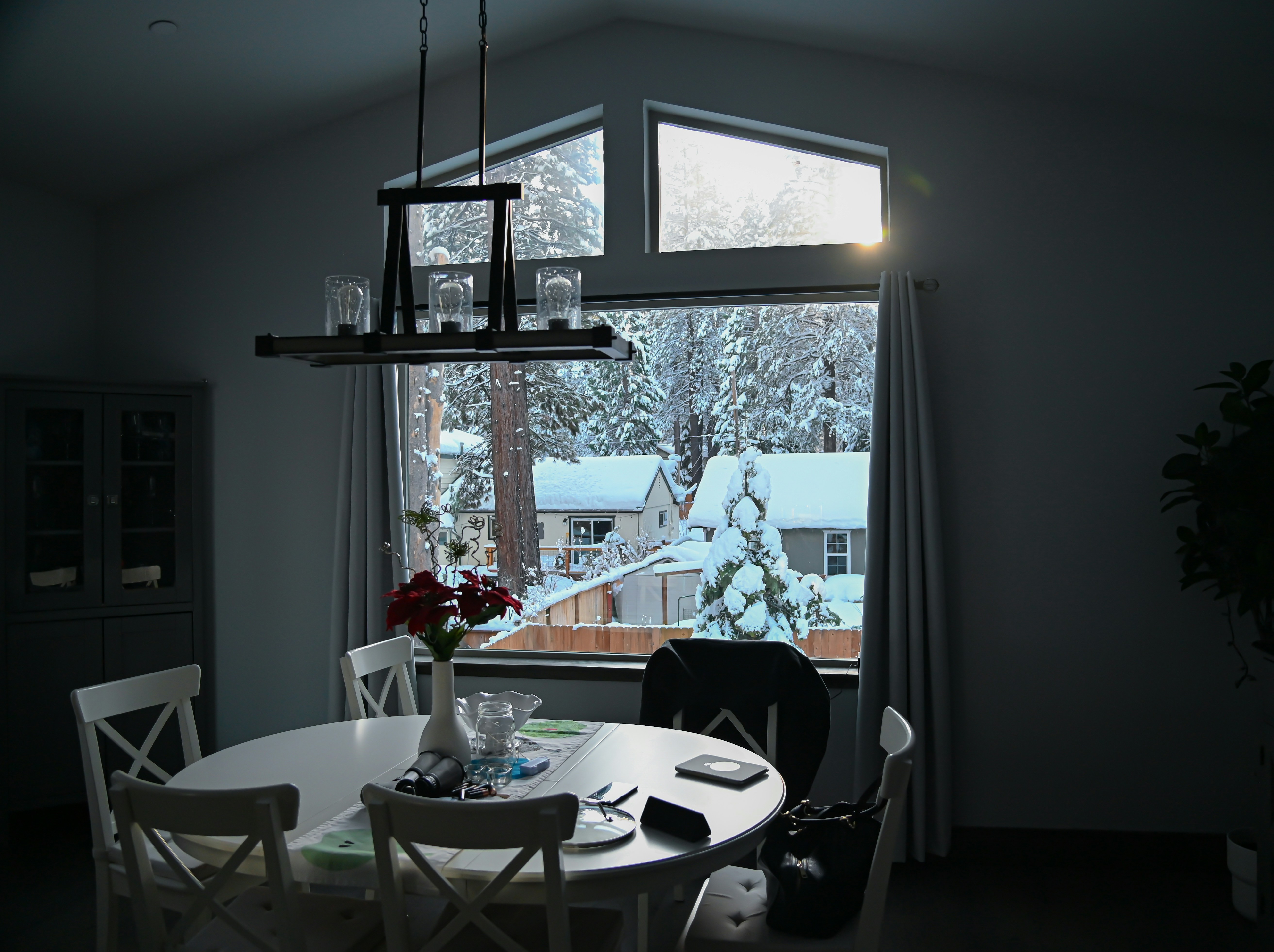 Hushed Winter Window: Quiet Dining Room Framing a Snowy Backyard