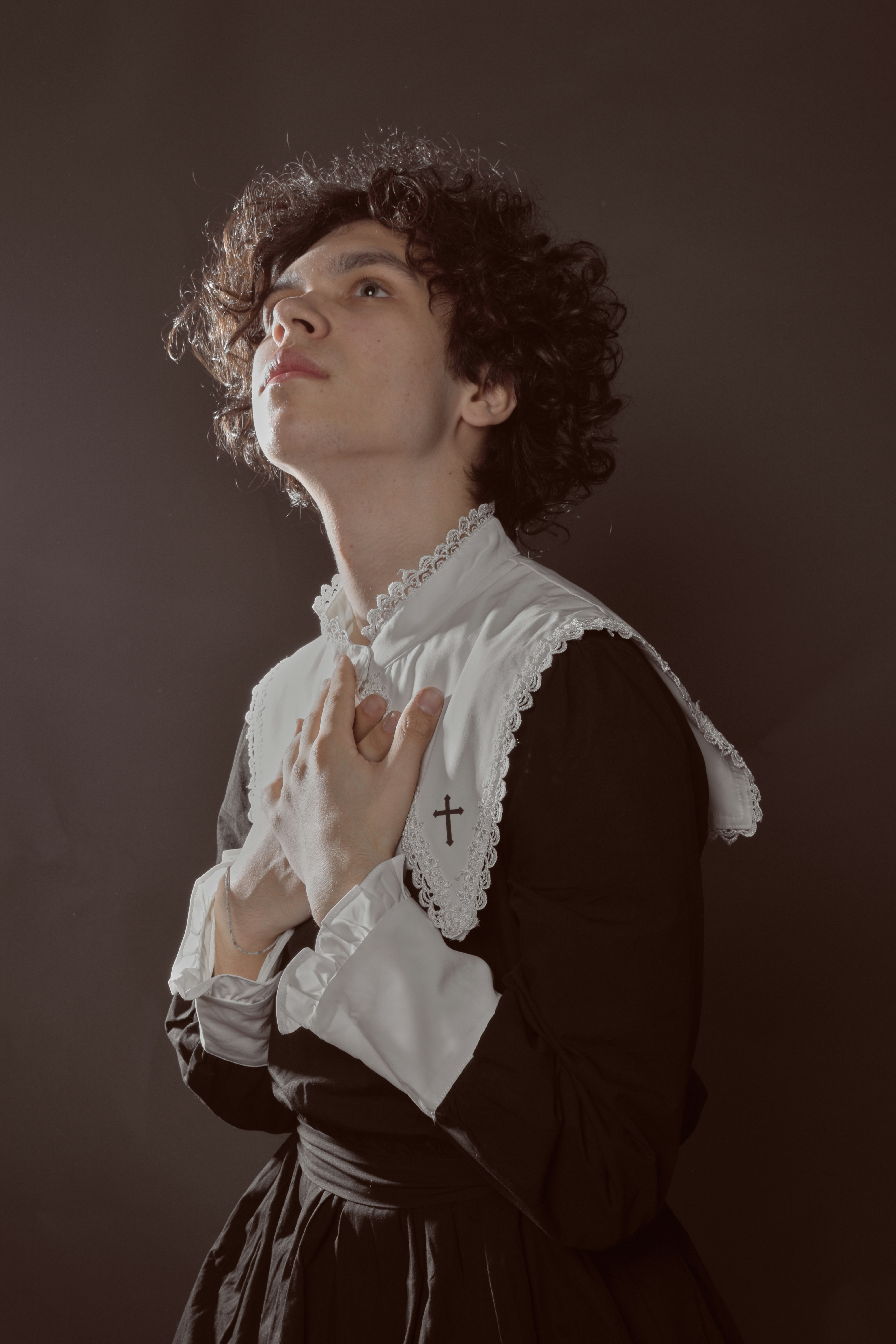 Pious Gaze: A Quiet Reverence in Victorian Attire