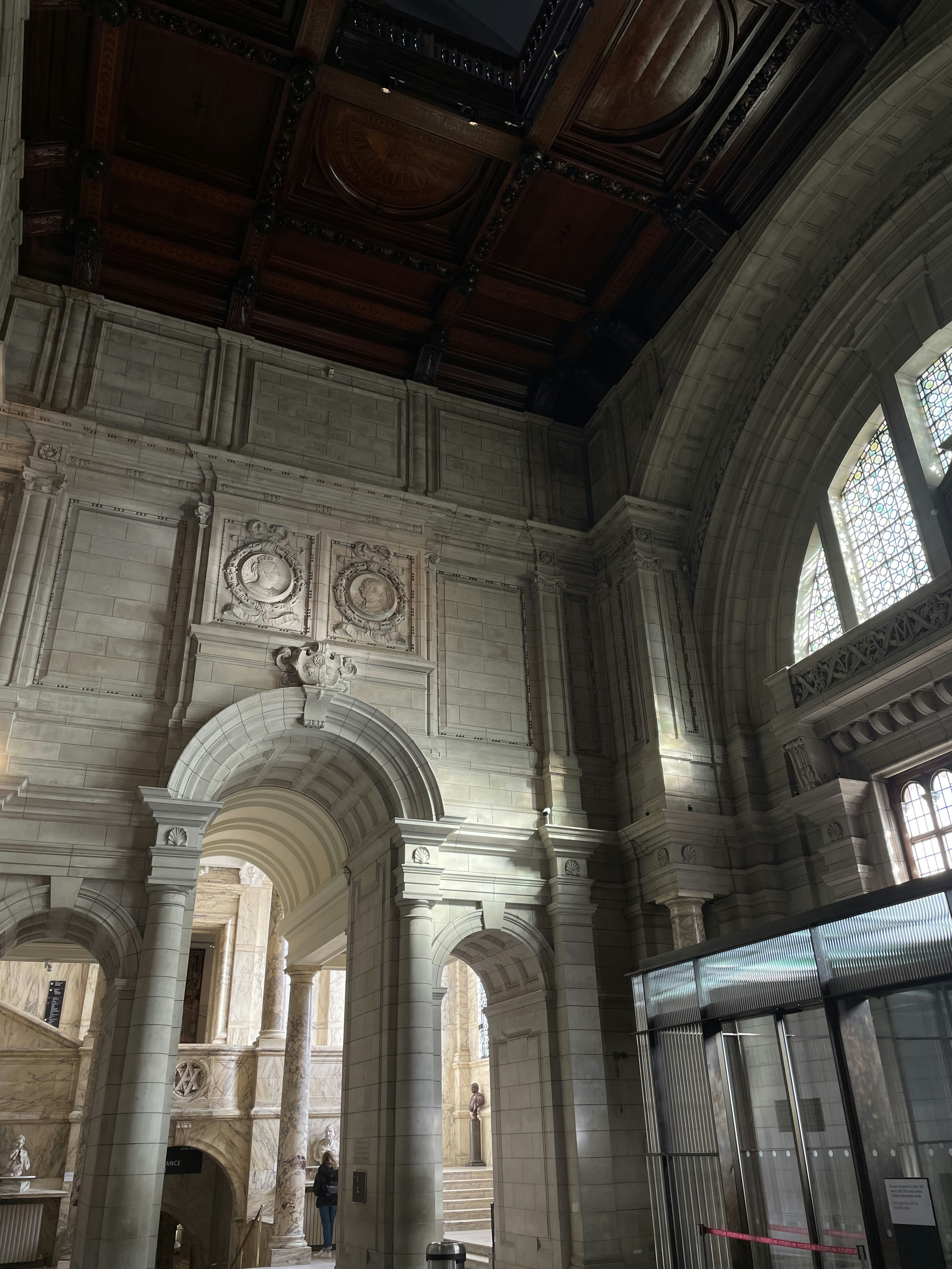 Archway Serenade: Sunlit Stone and Wooden Ceiling in a Historic Hall