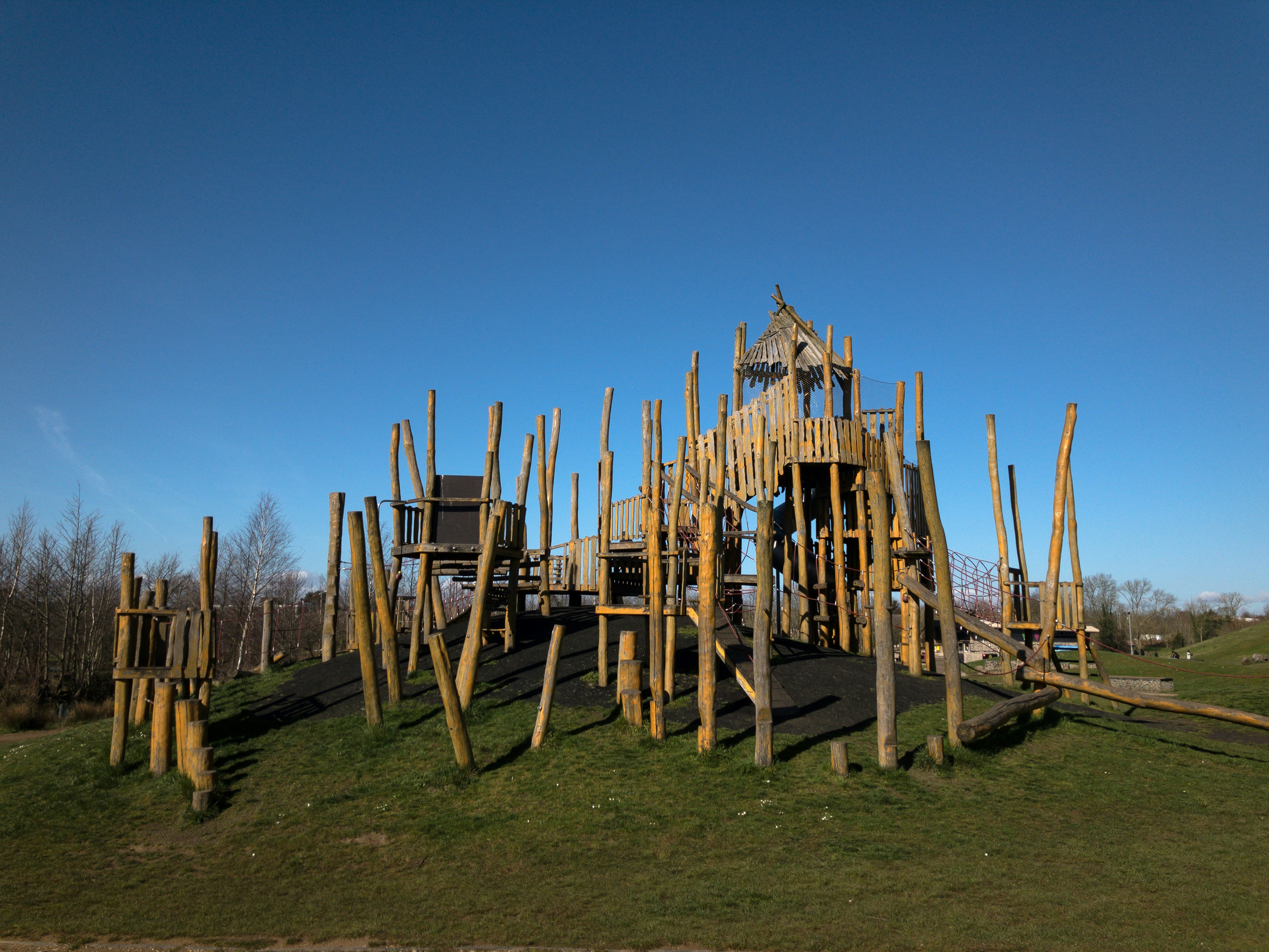 A wooden structure made out of sticks and logs photo – Free Playground ...