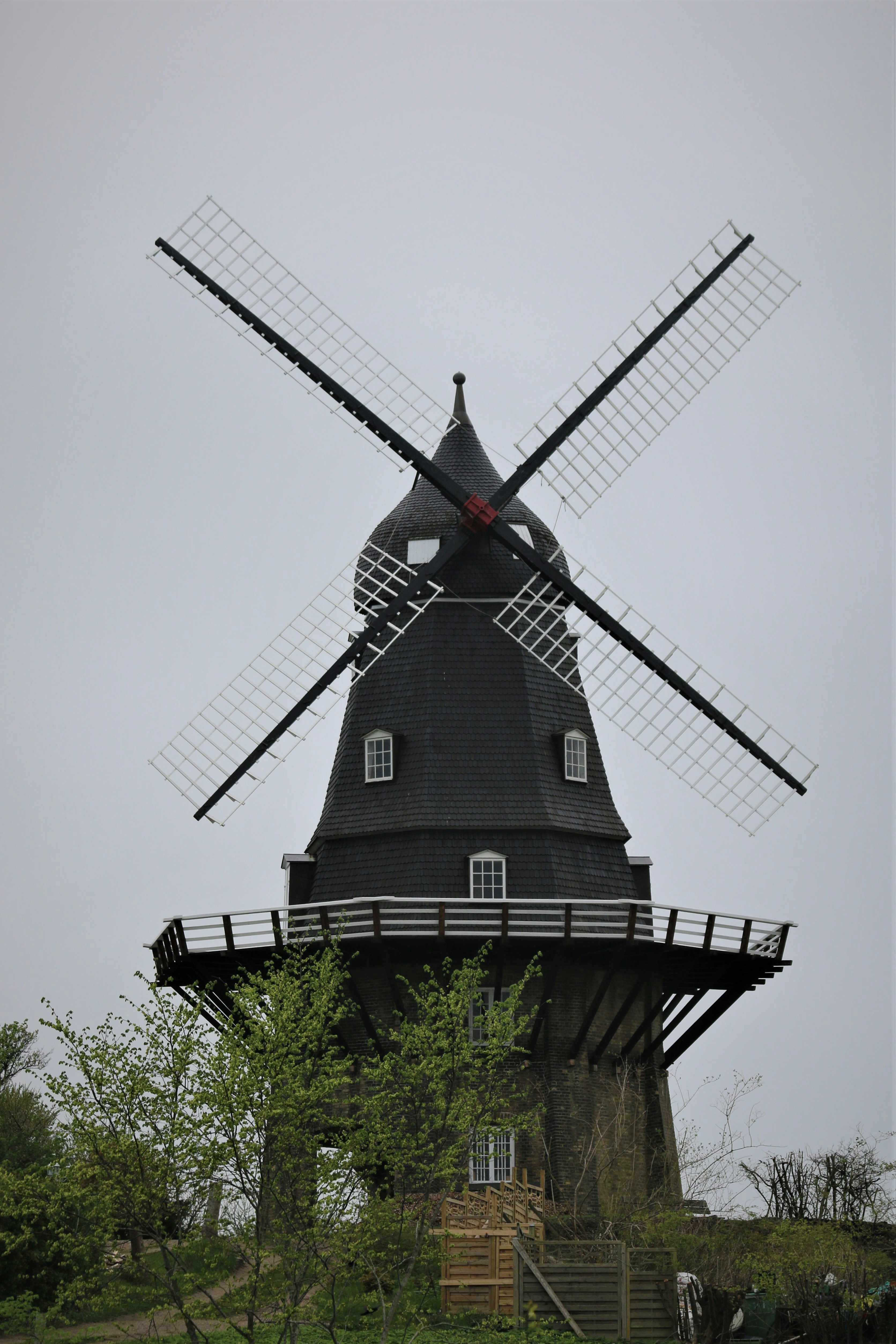 A windmill with a red light on top of it photo – Free Grey Image on ...