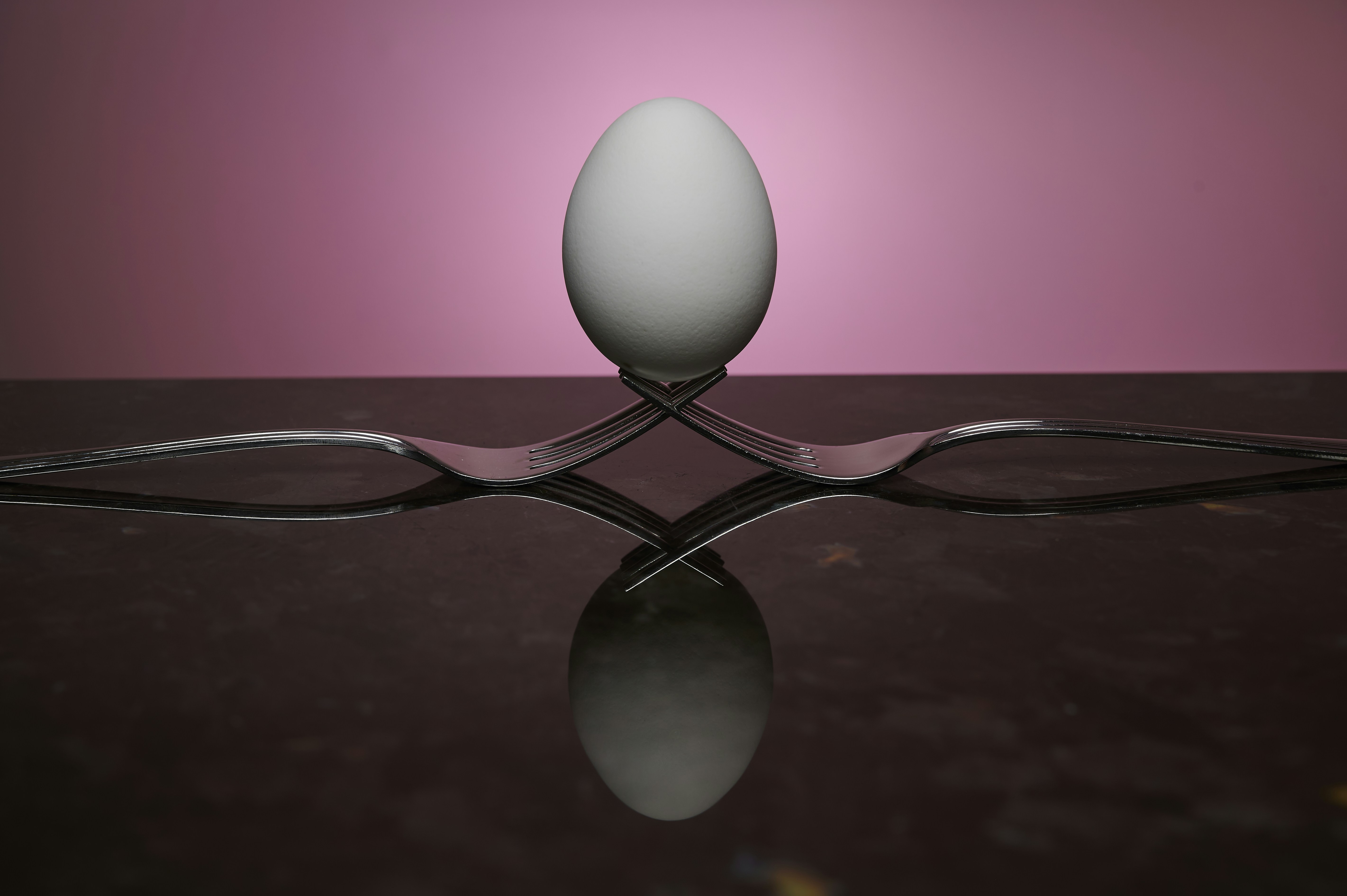 a fork and an egg on a table