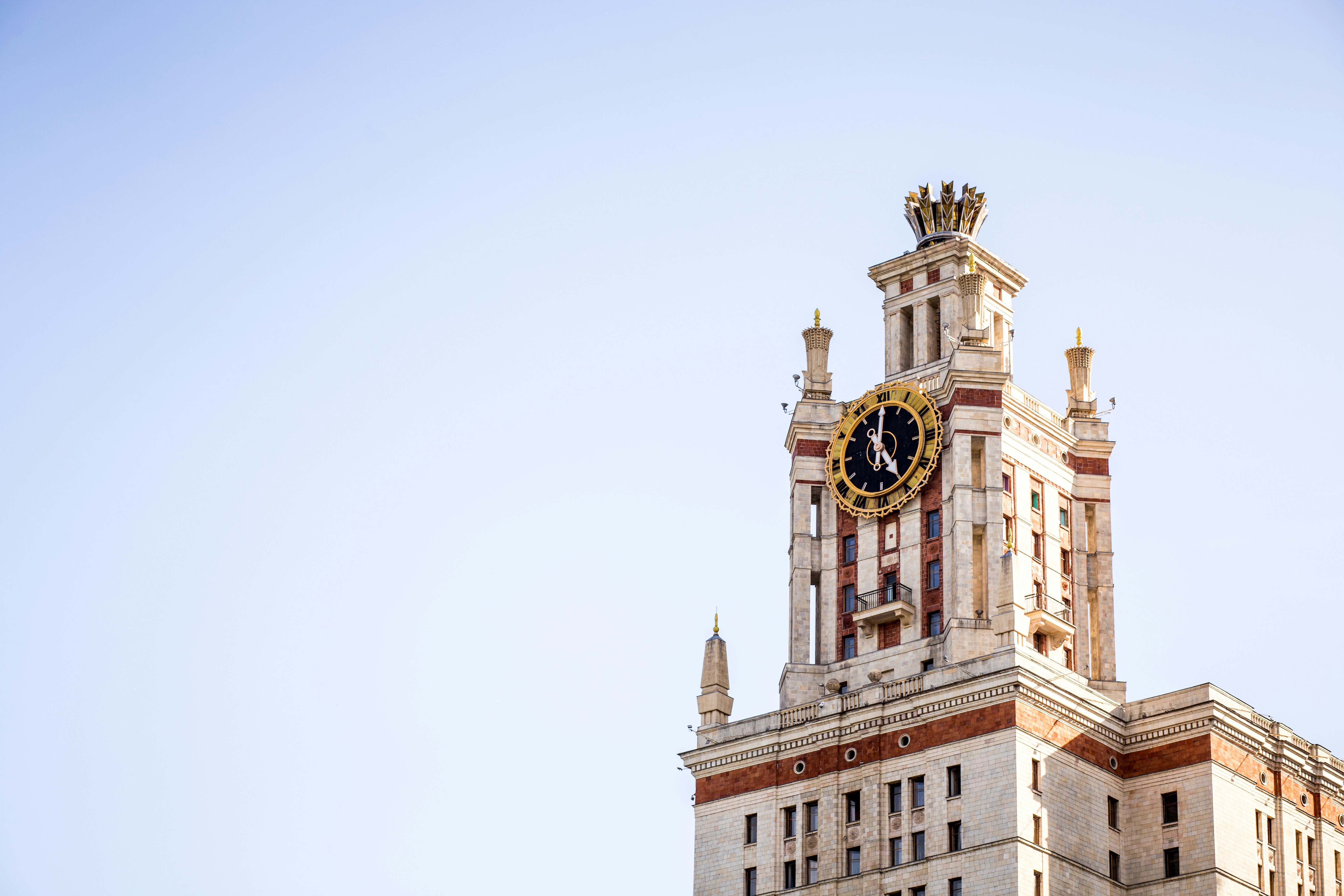 A large building with a clock on the top of it photo – Free Building ...
