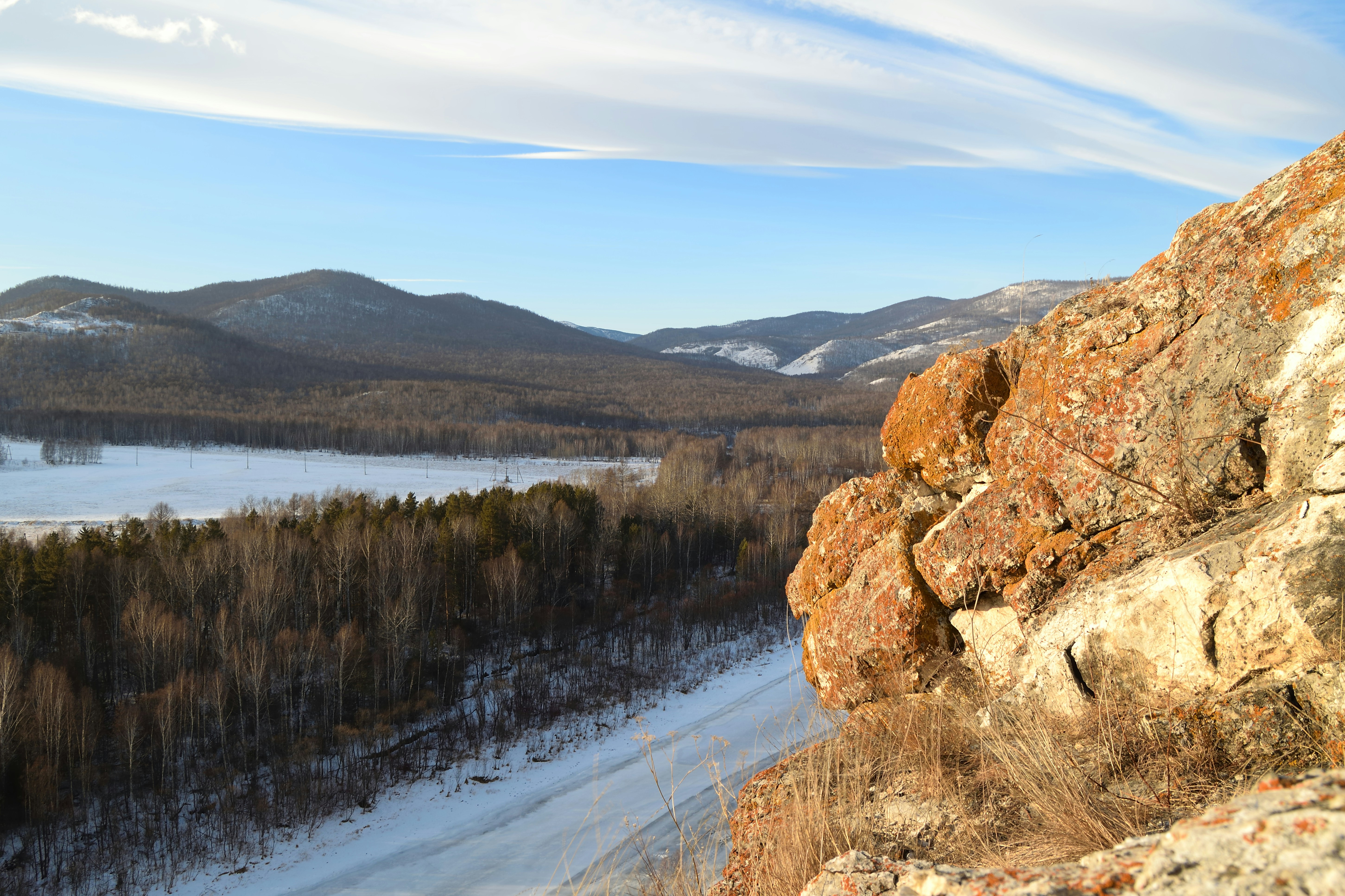 a scenic view of a snowy mountain valley