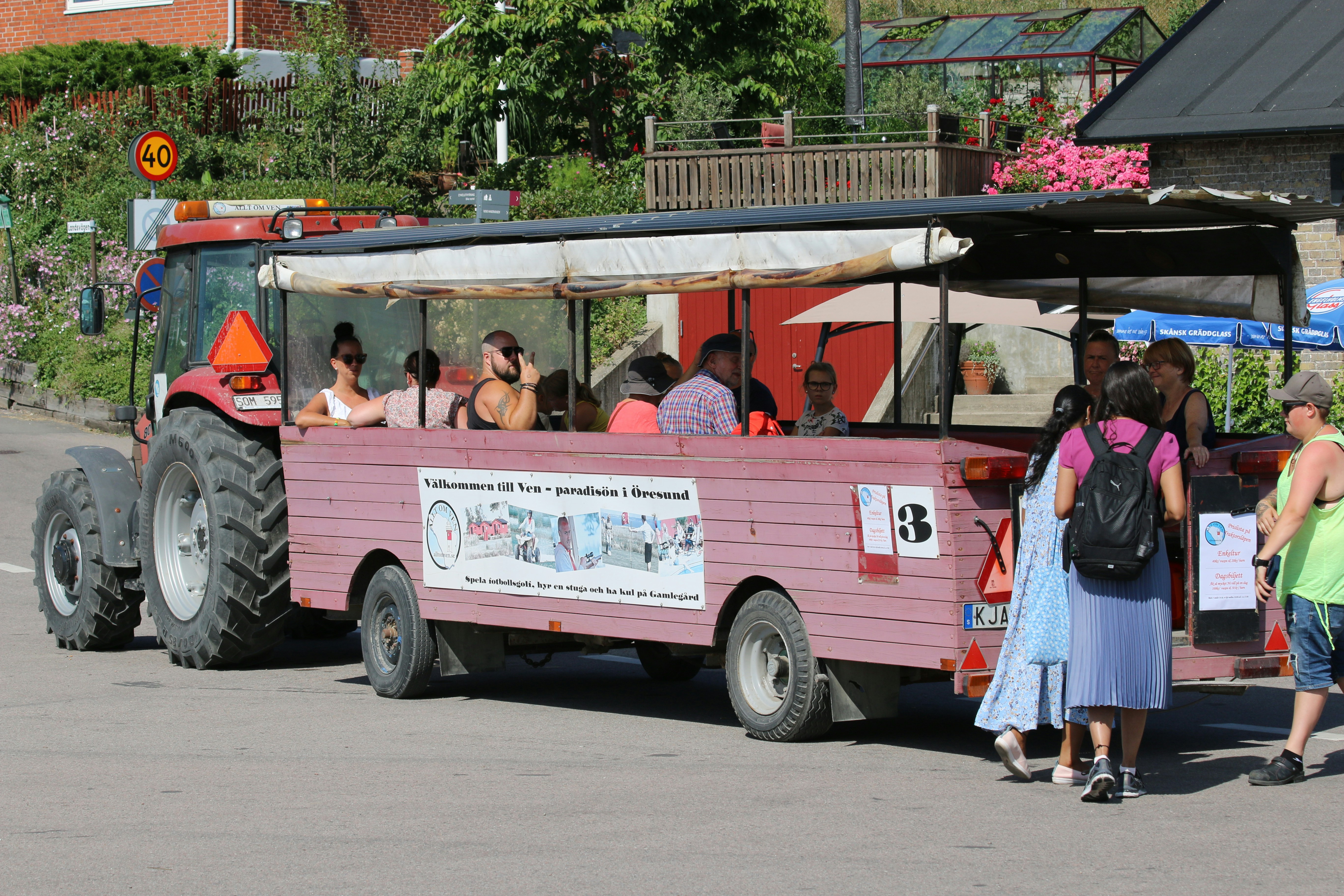 Sunlit Open-Sided Tour Bus Sparks a Moment in the Town Square