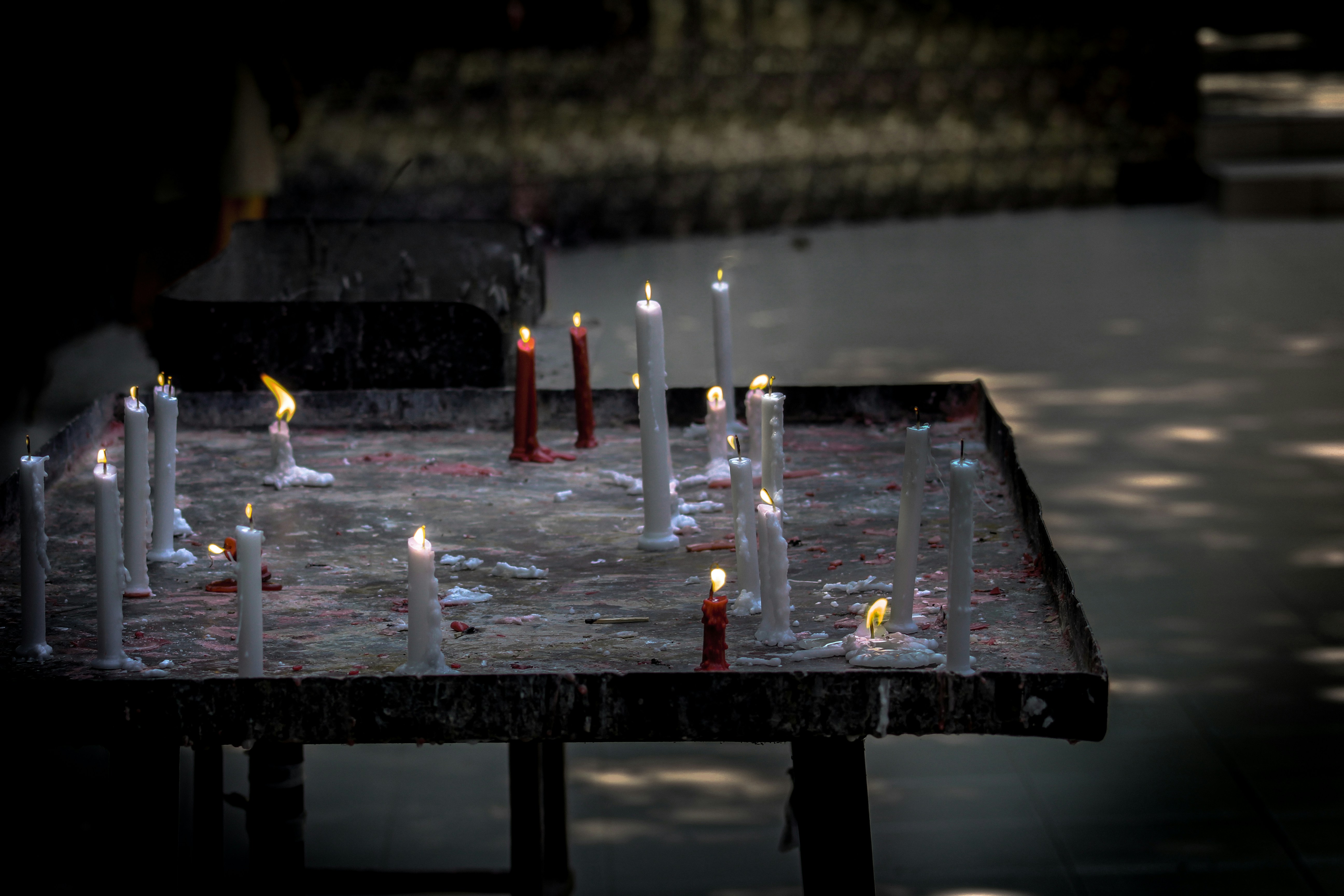 Candlelit Vigil on a Weathered Table