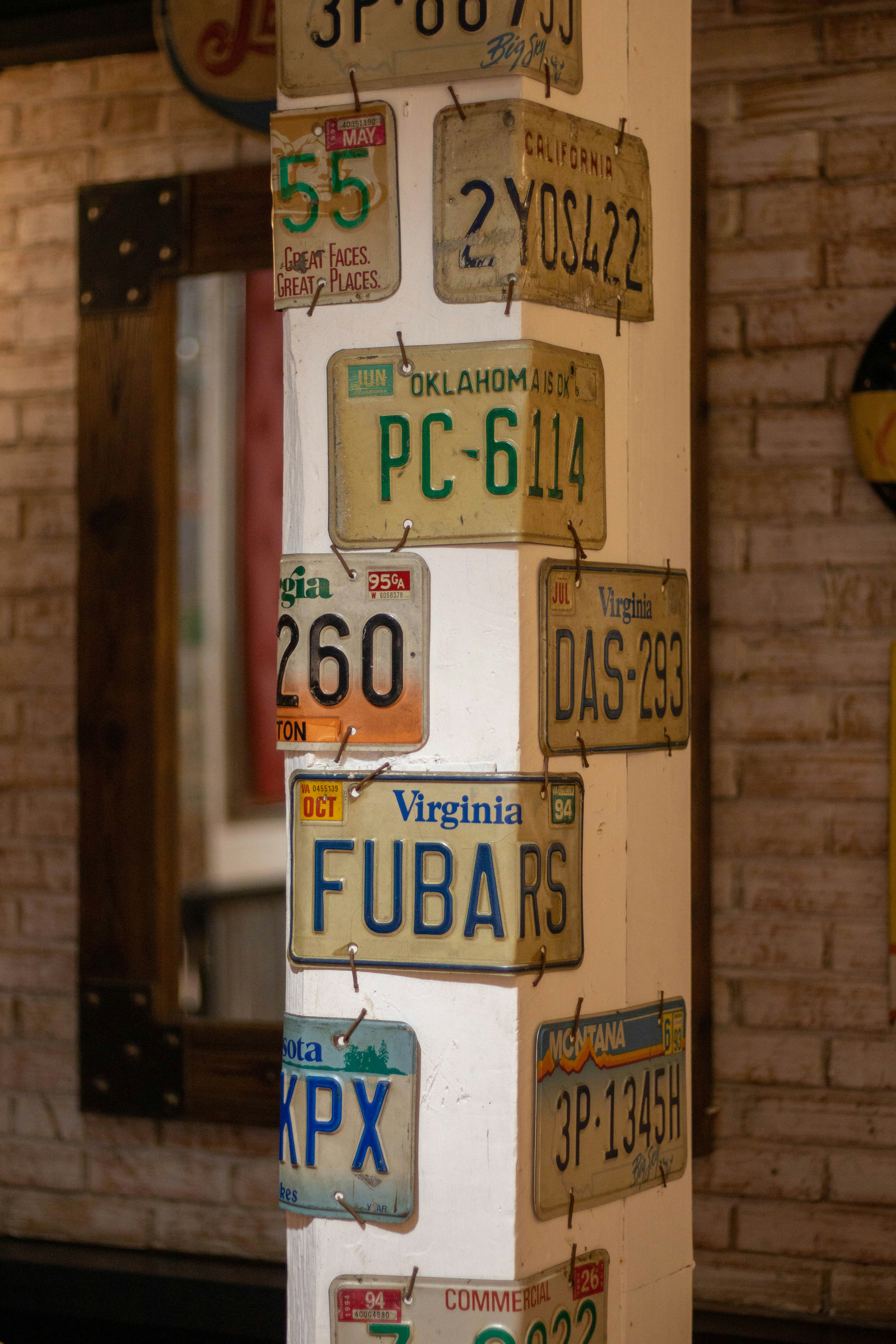 A bunch of license plates are stacked on top of each other photo – Free ...