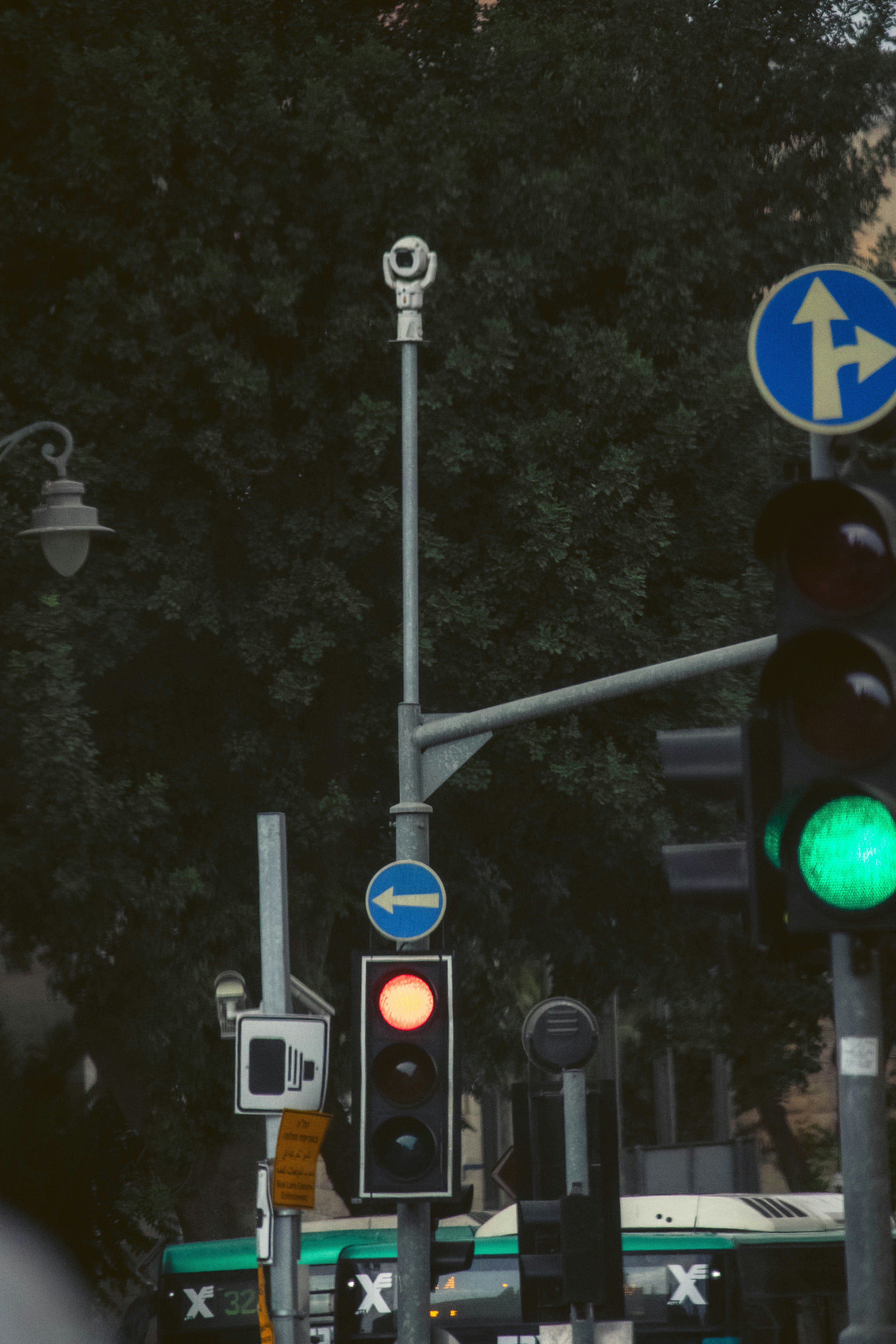 A traffic light and street signs on a city street photo – Free Black ...