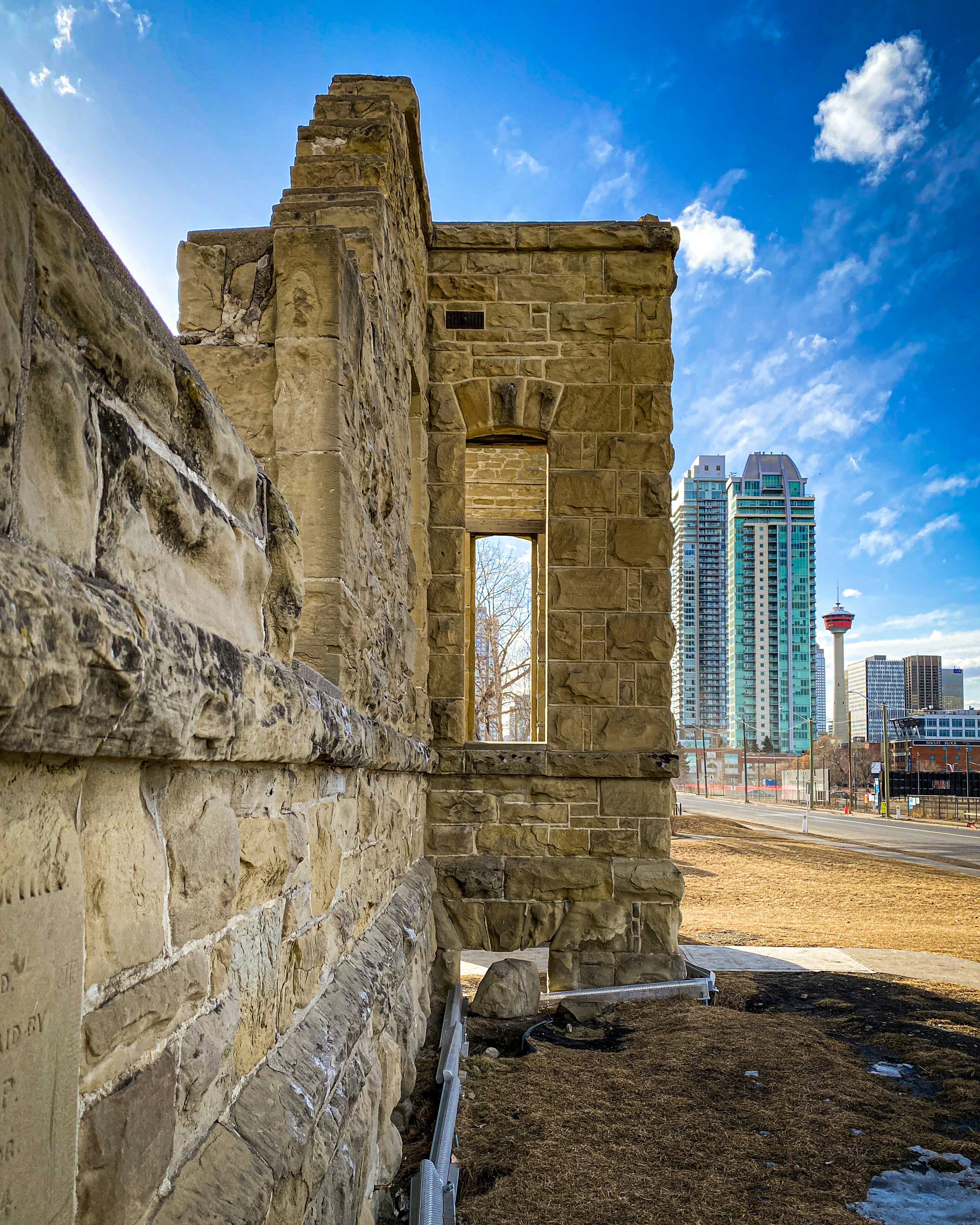 Weathered Arch Framing a Glass City Skyline