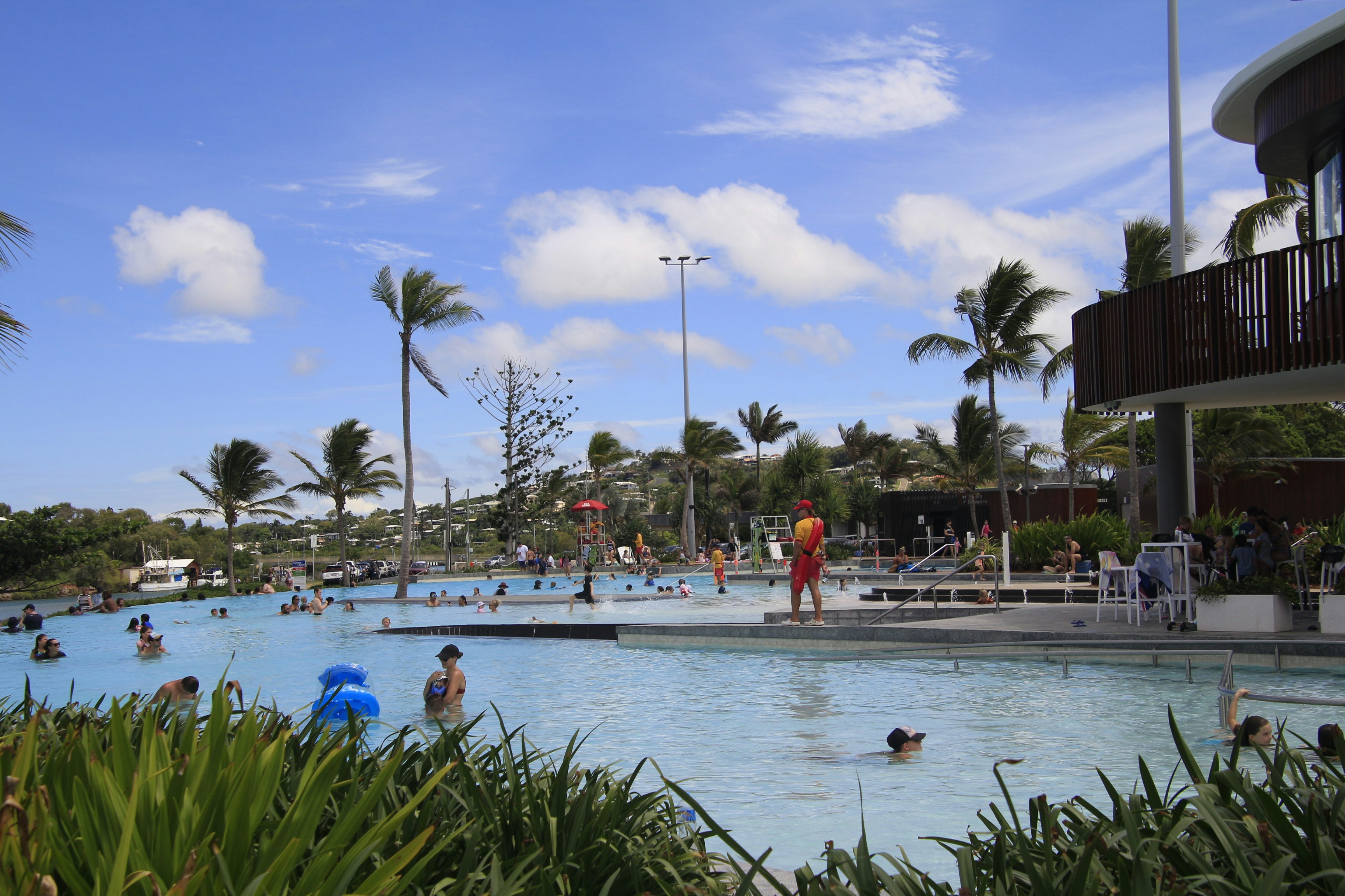 A large swimming pool with people in it photo – Free Water Image on ...