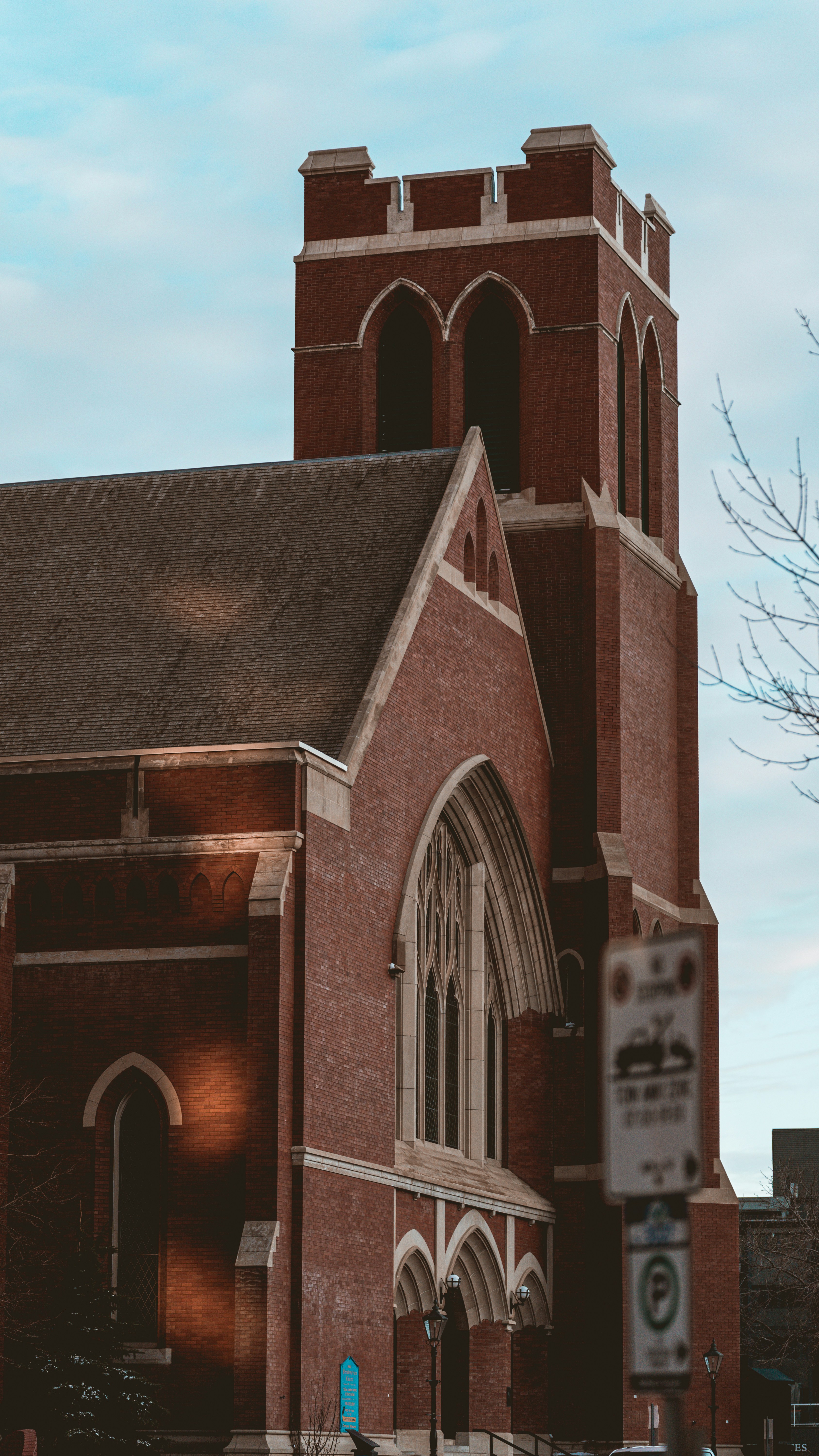 A large brick church with a clock tower photo – Free Grey Image on Unsplash