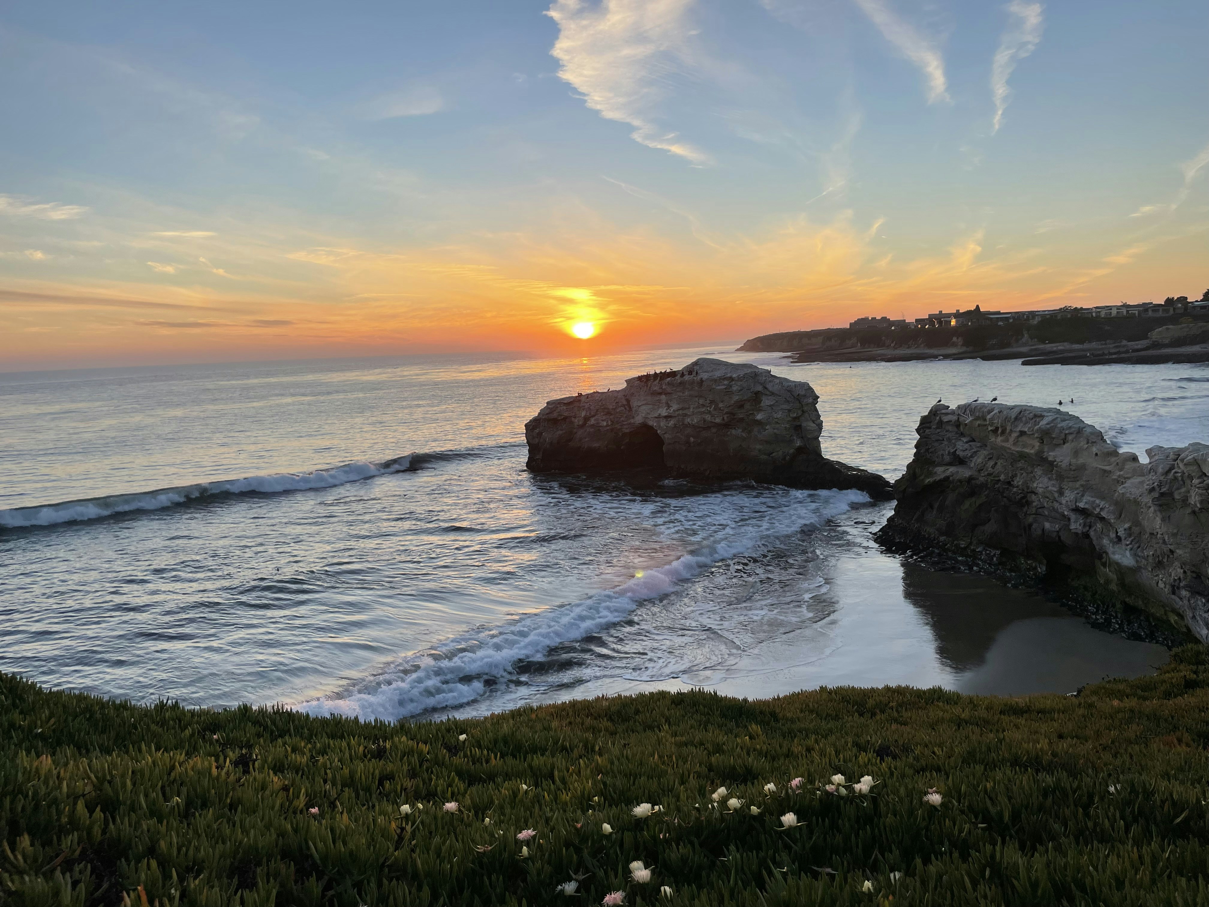 Dusk at the Cove: Sunlit Rocks Framing the Quiet Sea