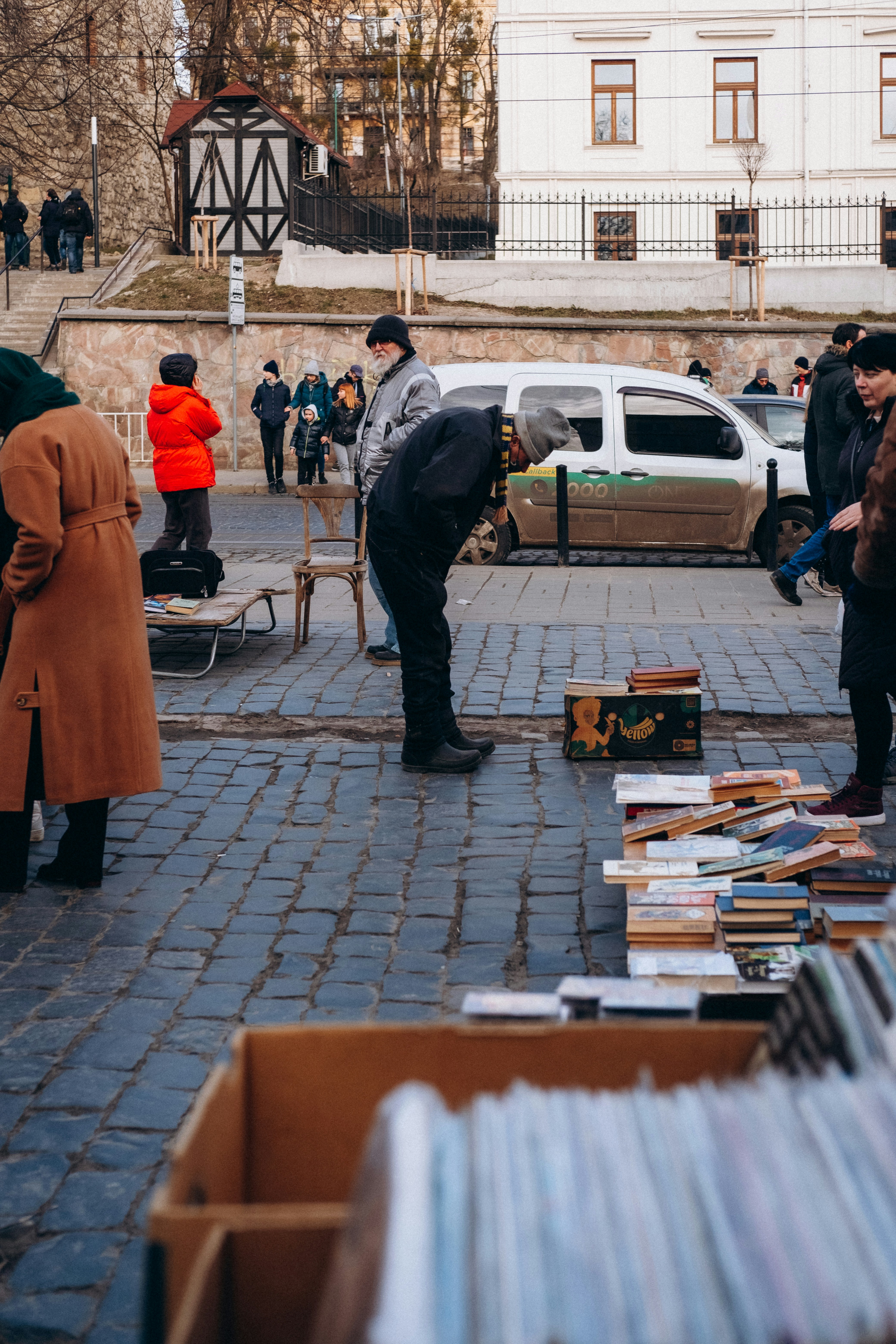 Vinyl and Volumes on Cobblestones: a Quiet Street-Market Moment
