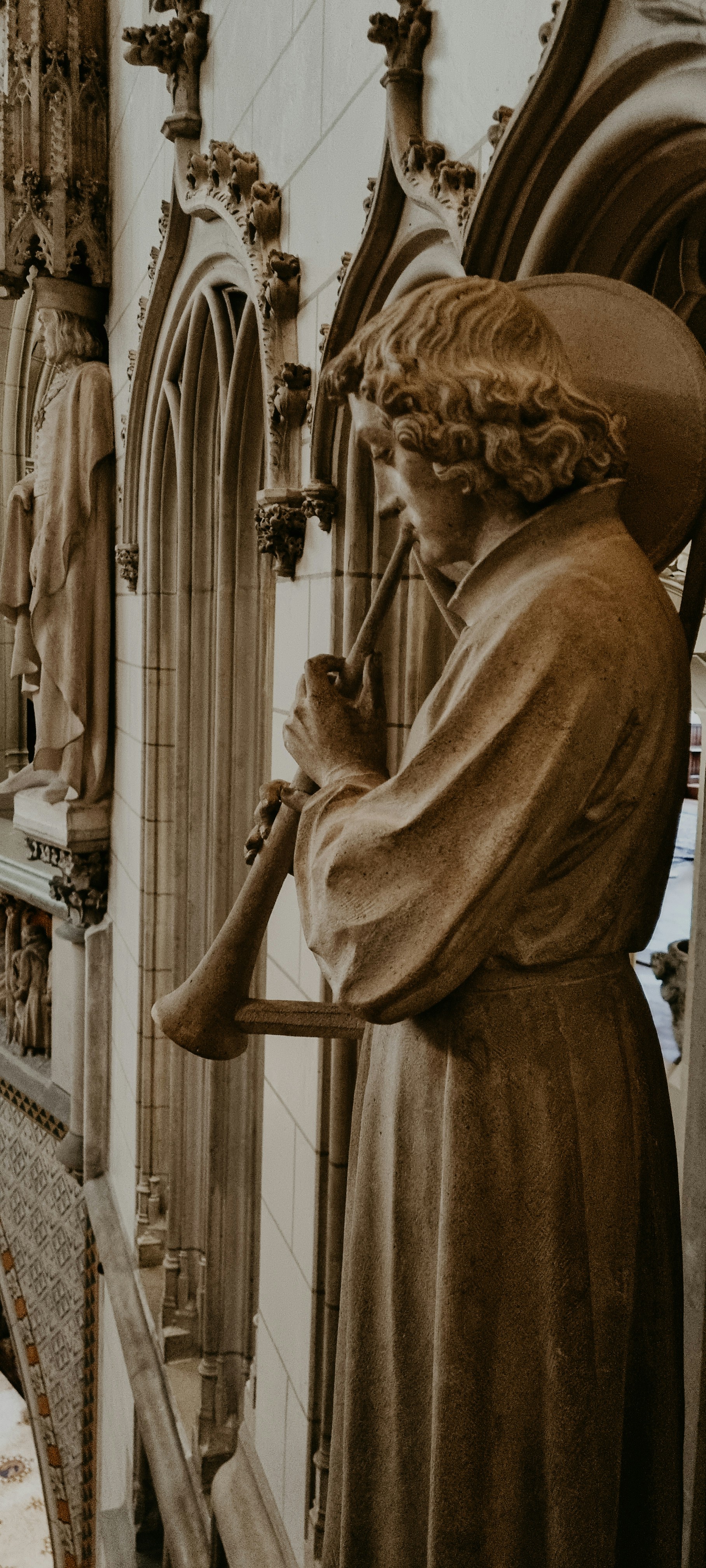 A statue of a man holding a pipe photo – Free Green Image on Unsplash