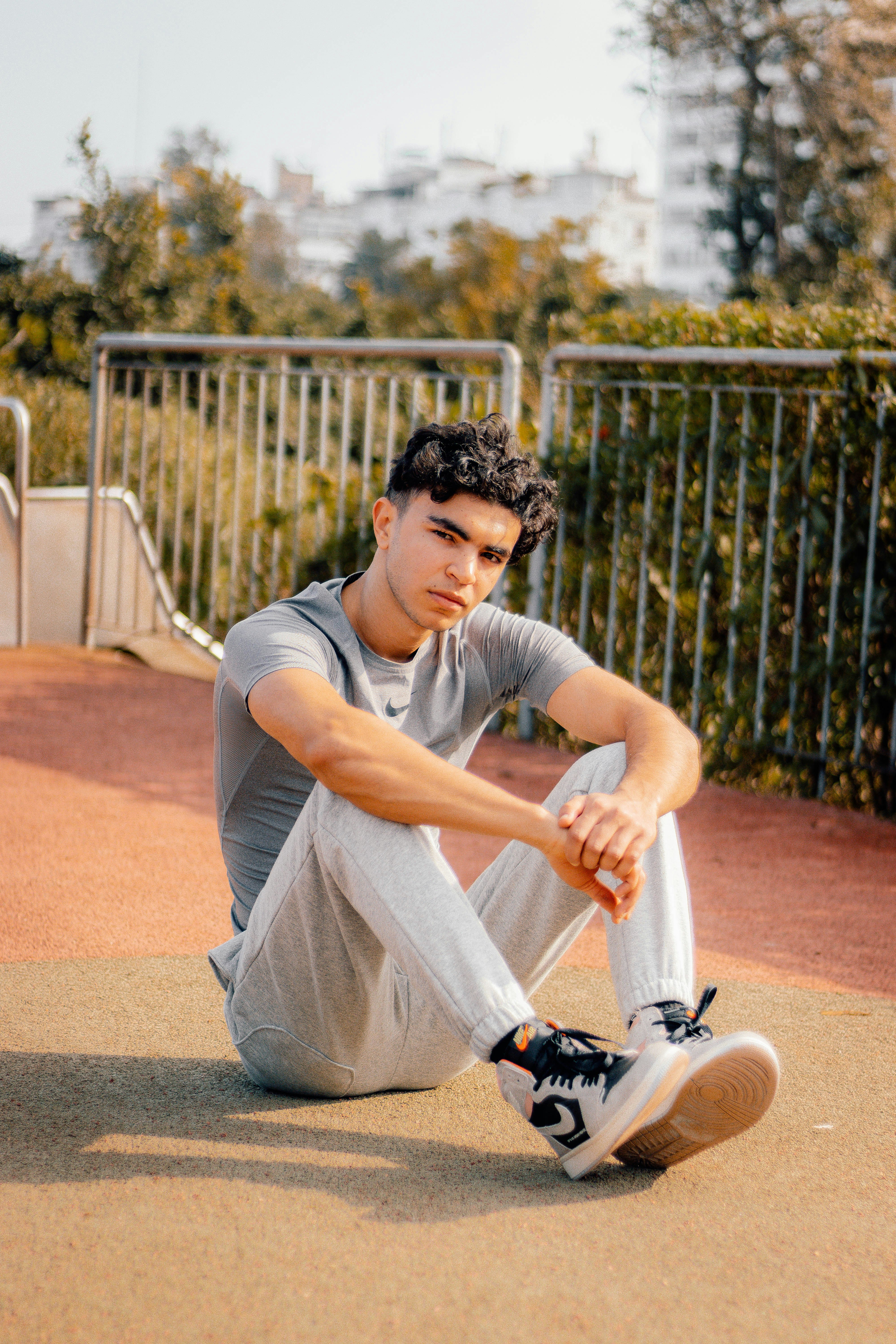 Quiet Confidence: Youthful Portrait on a Sunny Skate Park Bench