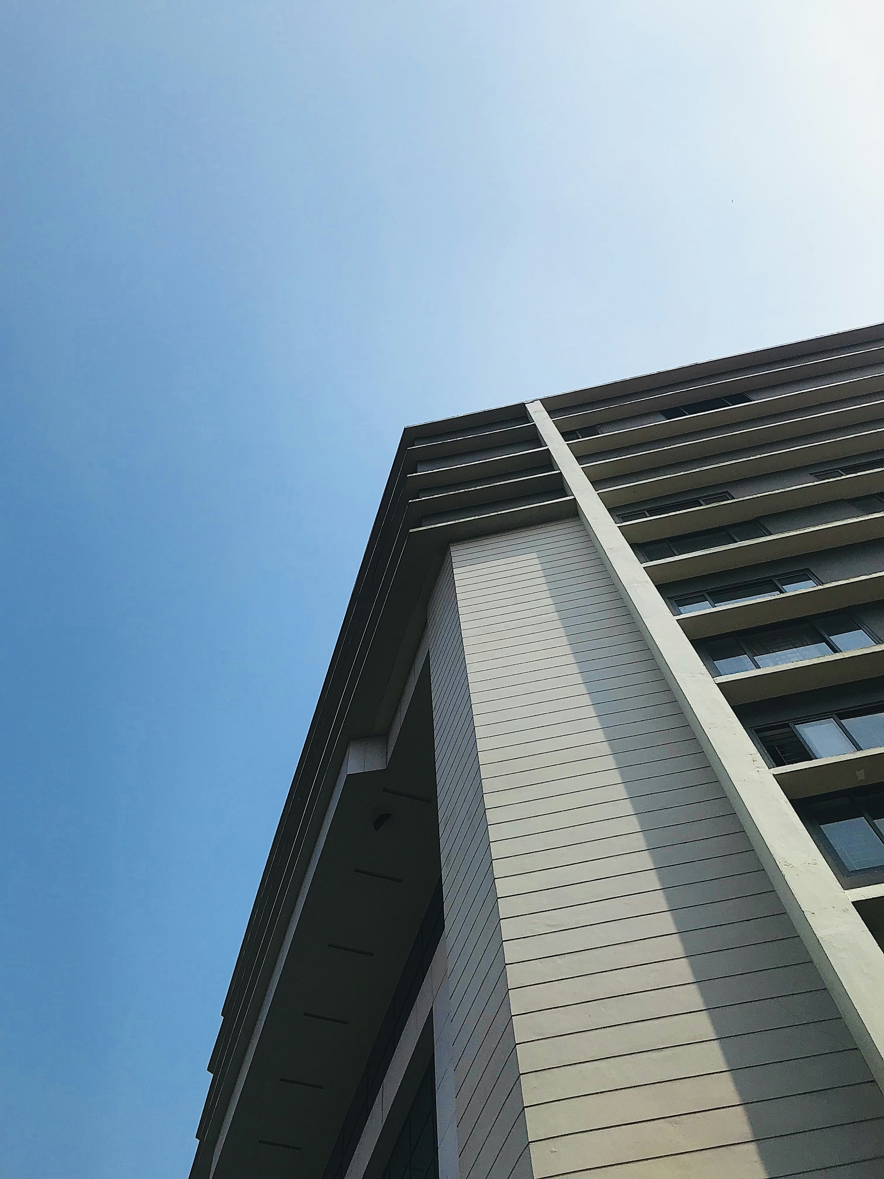 Building  | a tall building with a clock on the side of it