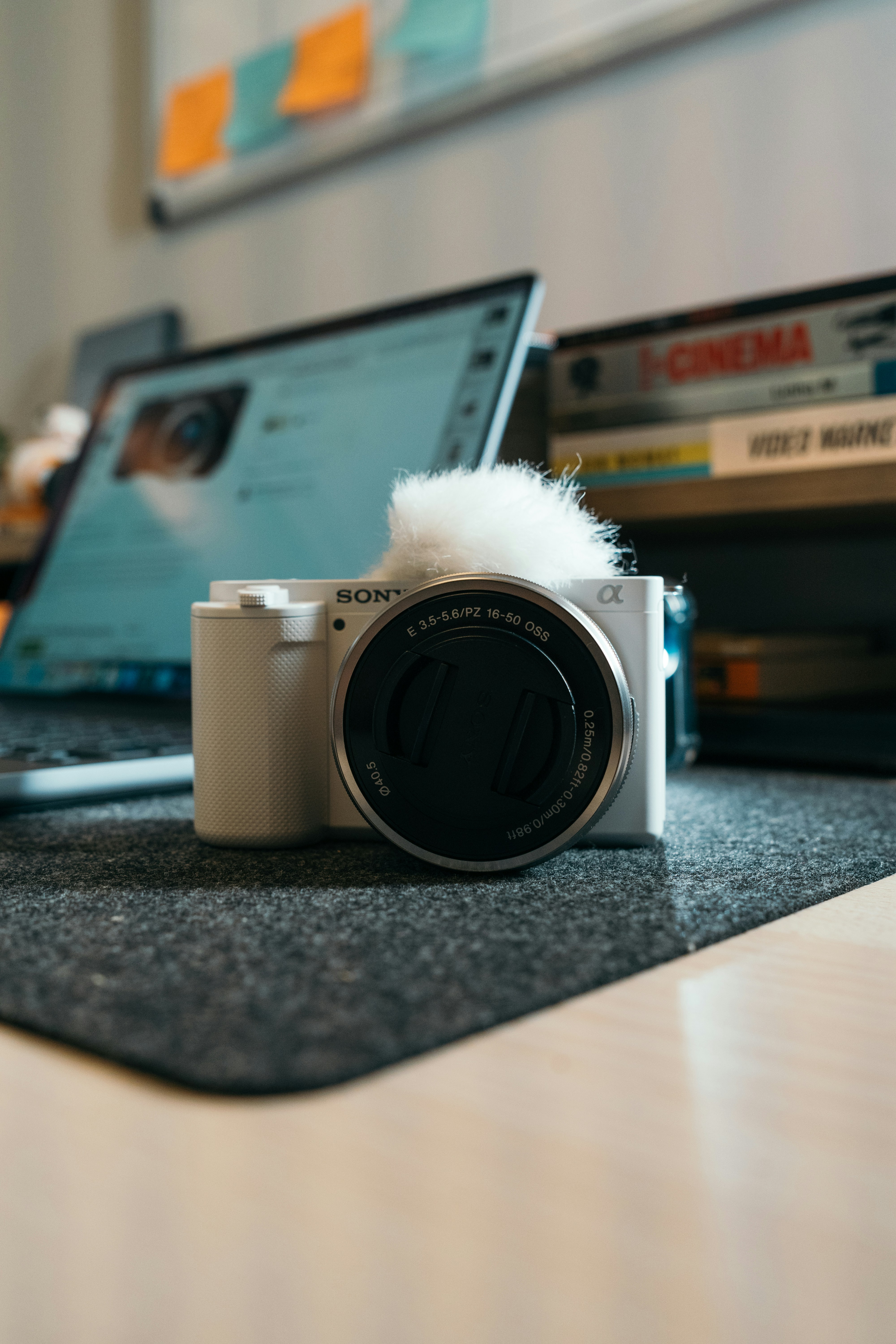 Desk-Side Focus: The Silver Sony A7 III Wears a Fluffy Windscreen