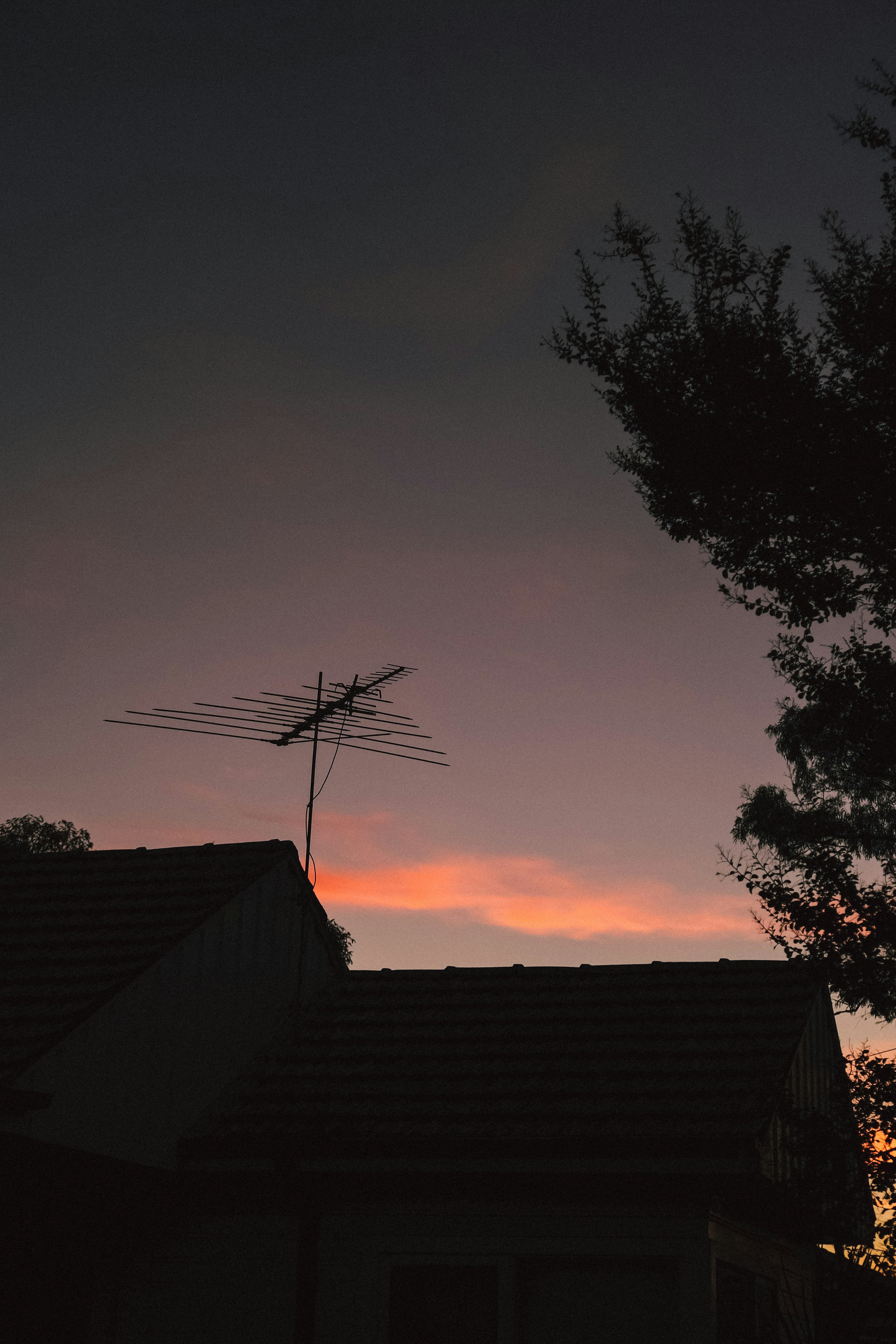 A house with a weather vane on top of it photo – Free Grey Image on ...