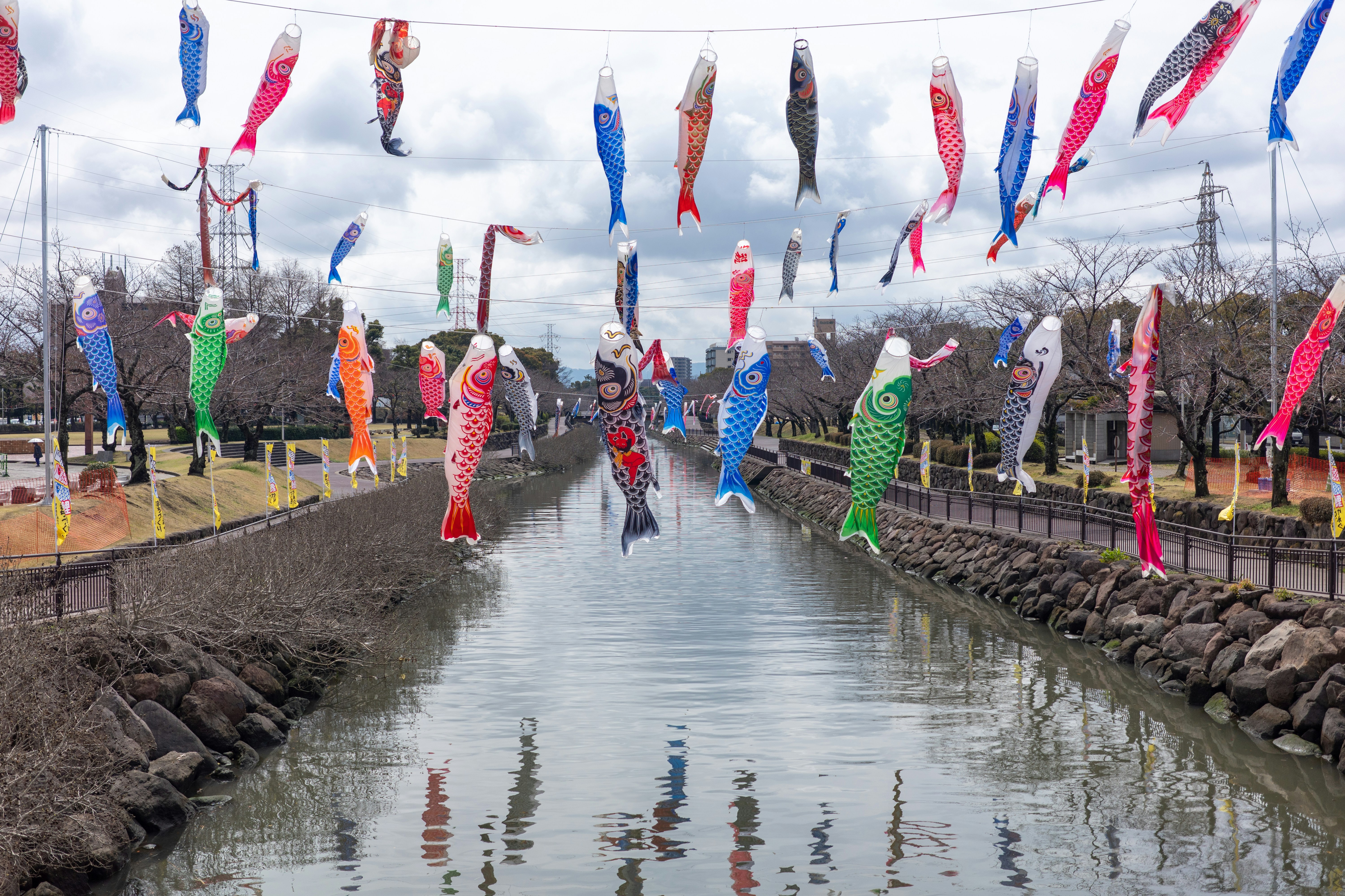 A stream of water filled with lots of colorful kites photo – Free ...