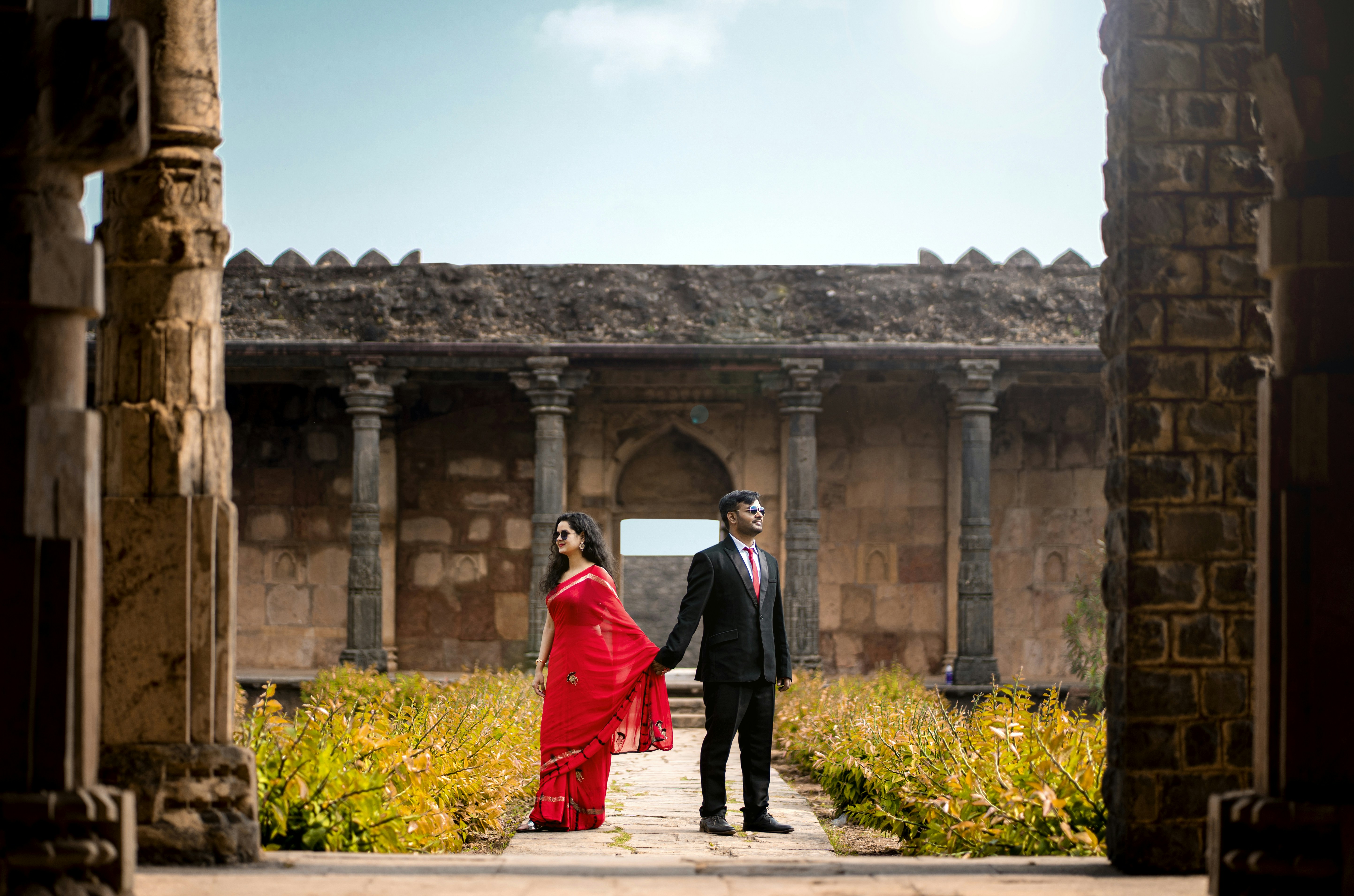 Two Figures in Reclaimed Courtyard: A Portrait of Contrasting Silhouettes