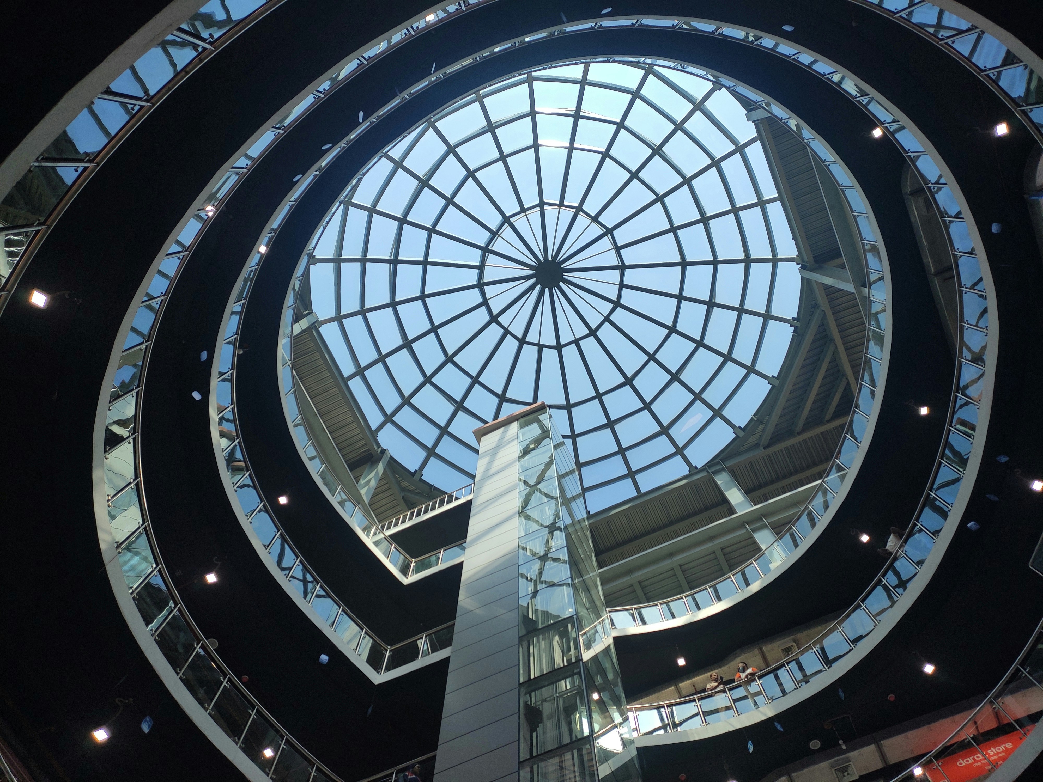 A circular glass ceiling in a building photo – Free Nobinagar bus stop ...