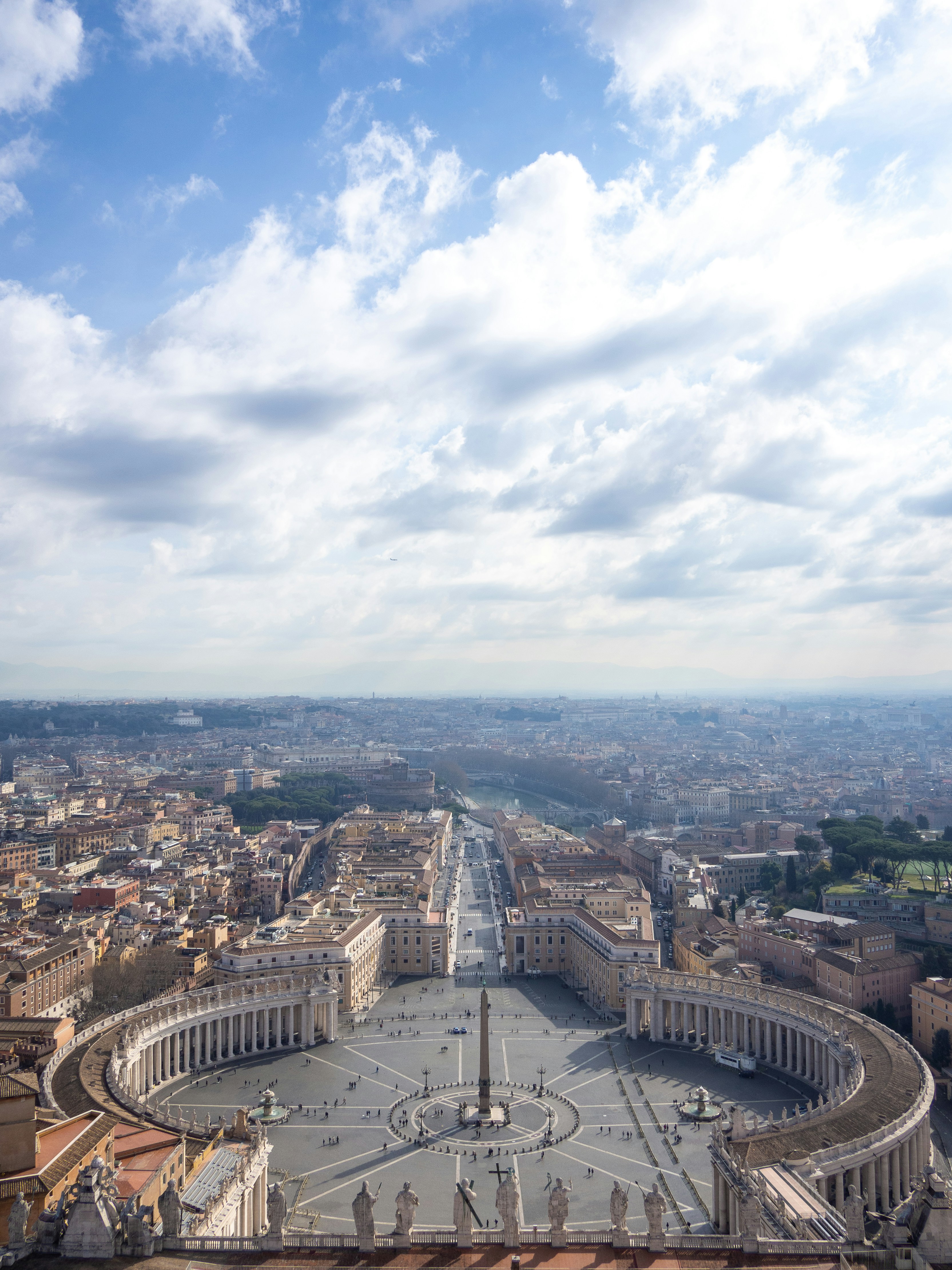 An aerial view of a city with a clock tower photo – Free Downtown Image ...