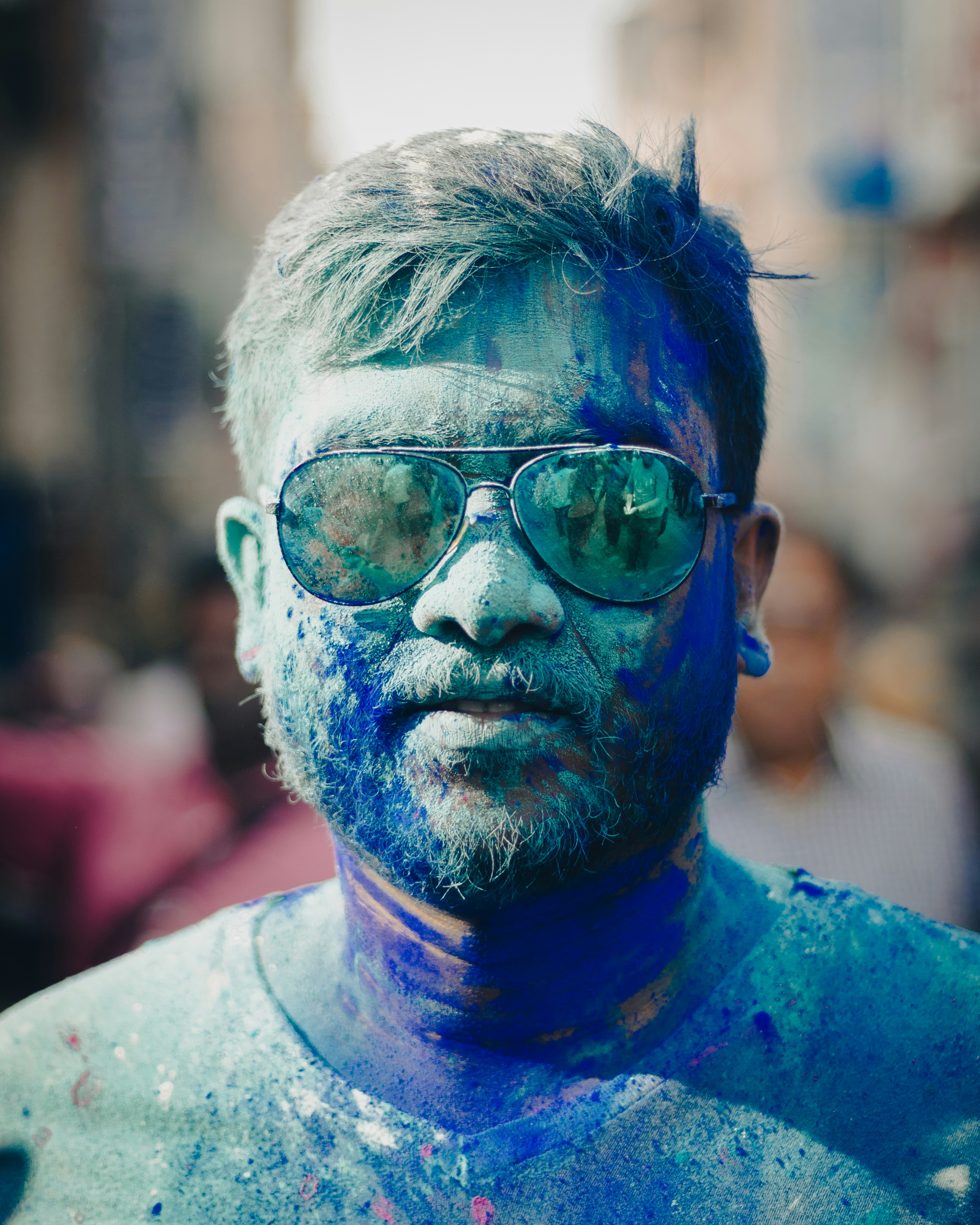 Chromatic Holi Portrait: Blue Powdered Gaze in the City